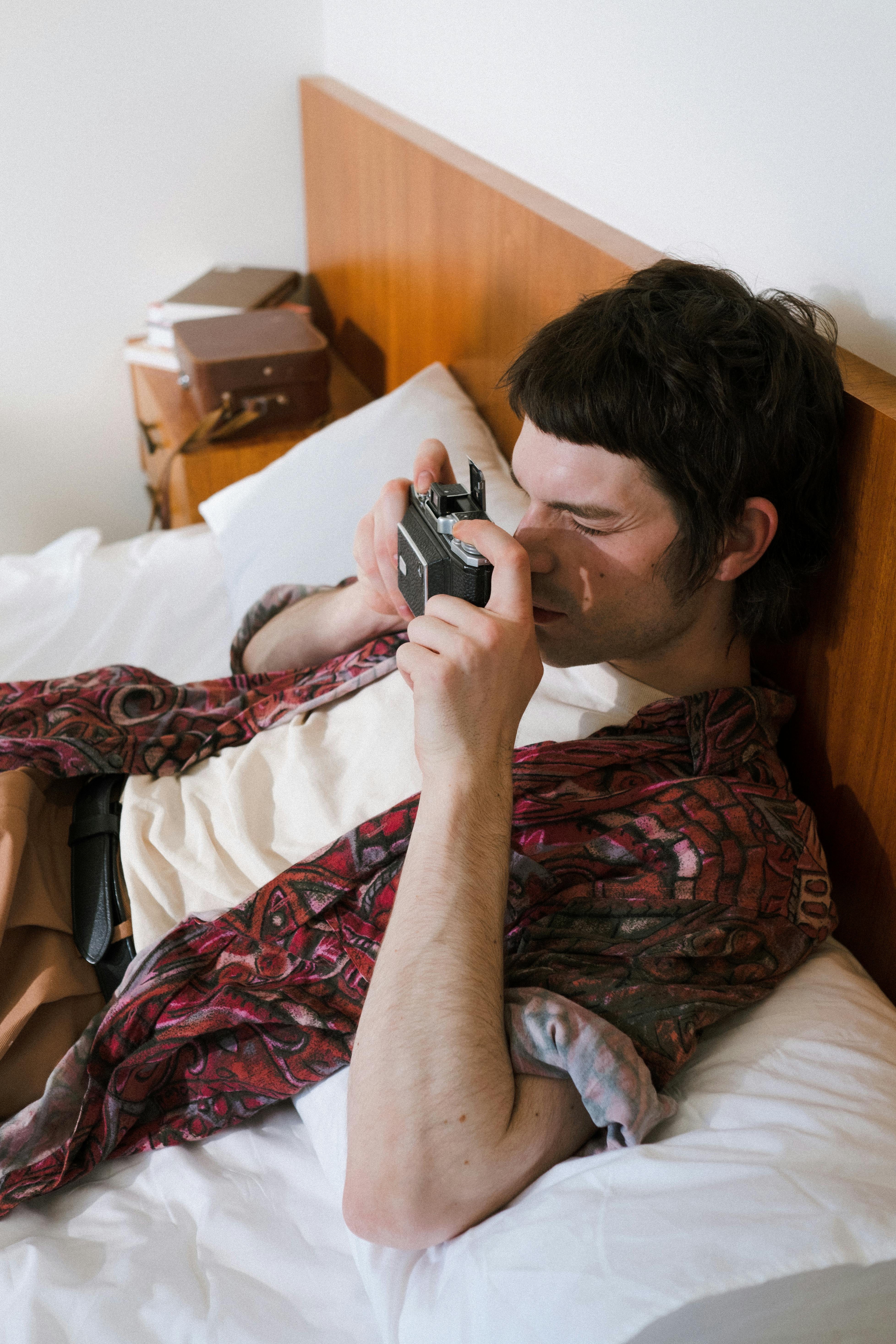 Woman in White and Blue Stripe Dress Shirt Holding a Camera · Free ...