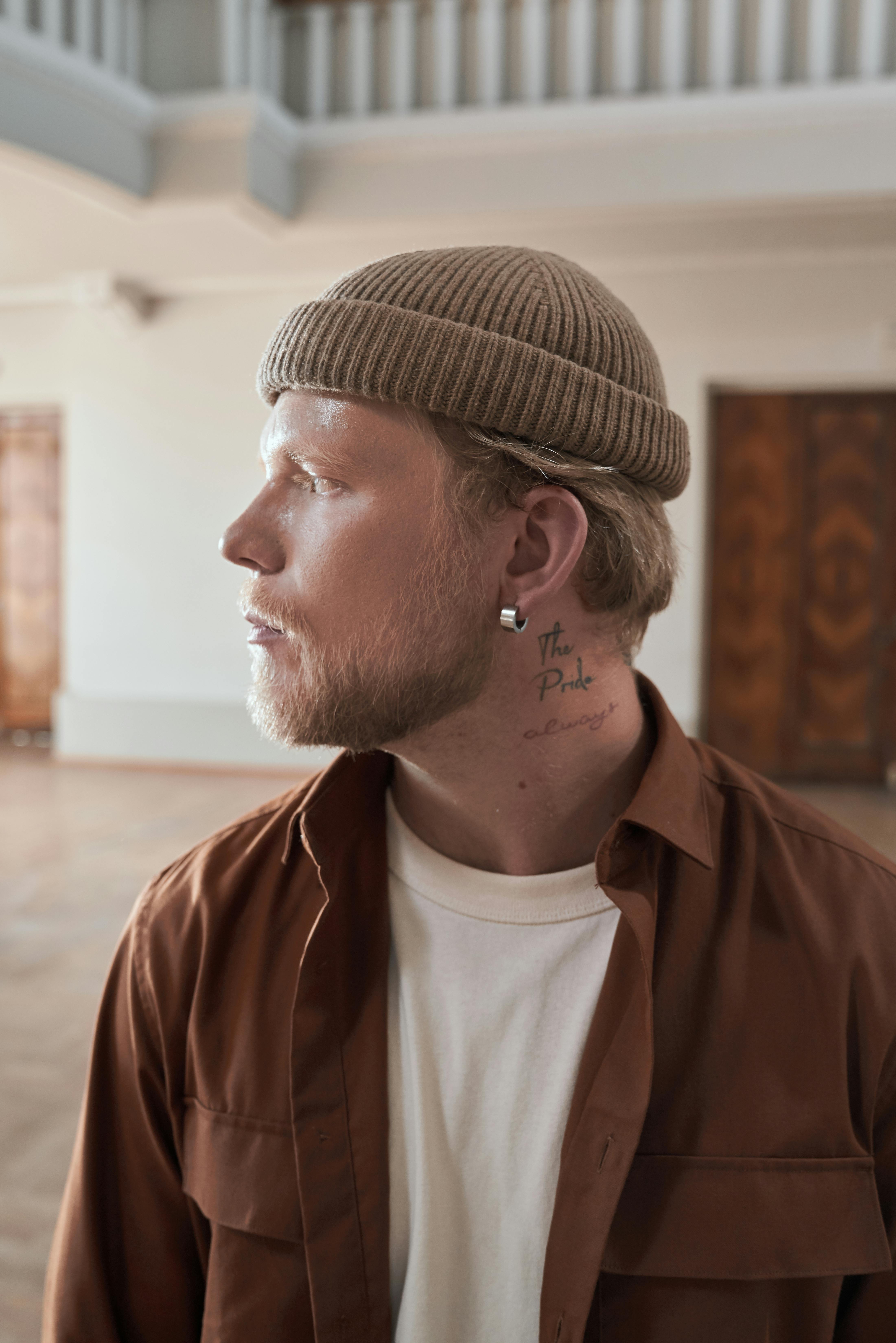 Photo of a Man Sitting under Lights · Free Stock Photo