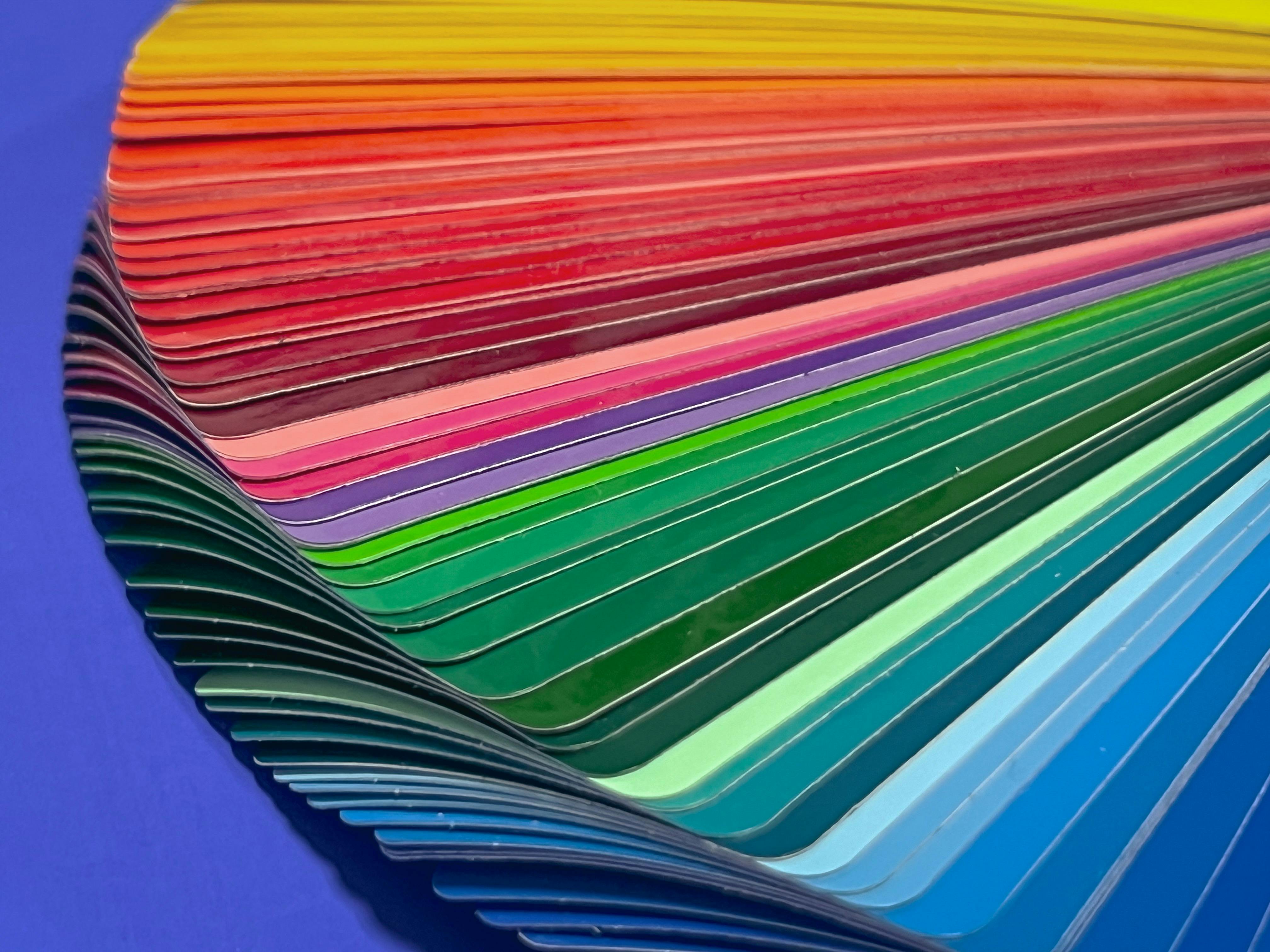 Gray Standard Color Book Near Green Eraser · Free Stock Photo