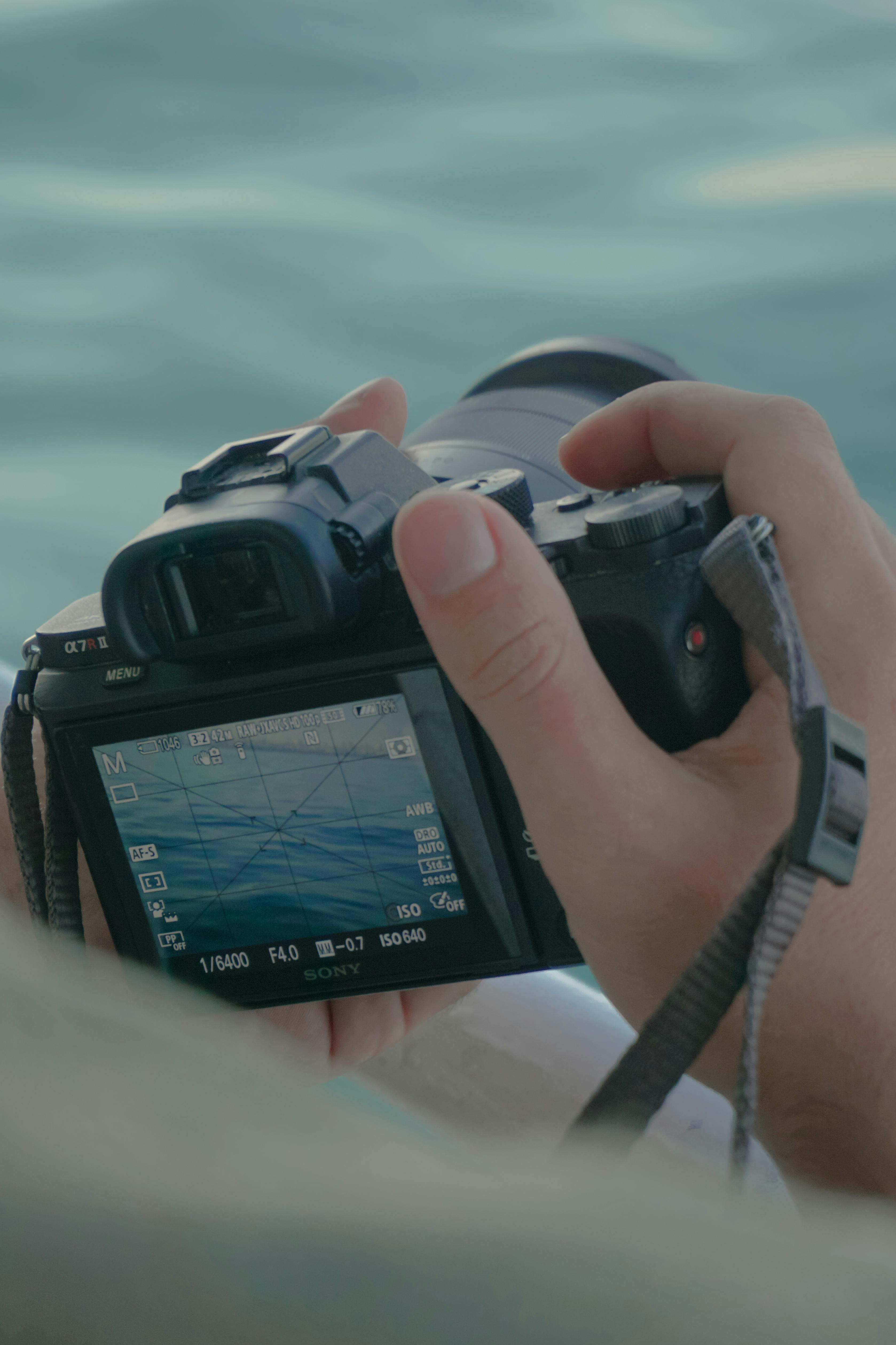 A Person Holding a Black Gimbal · Free Stock Photo