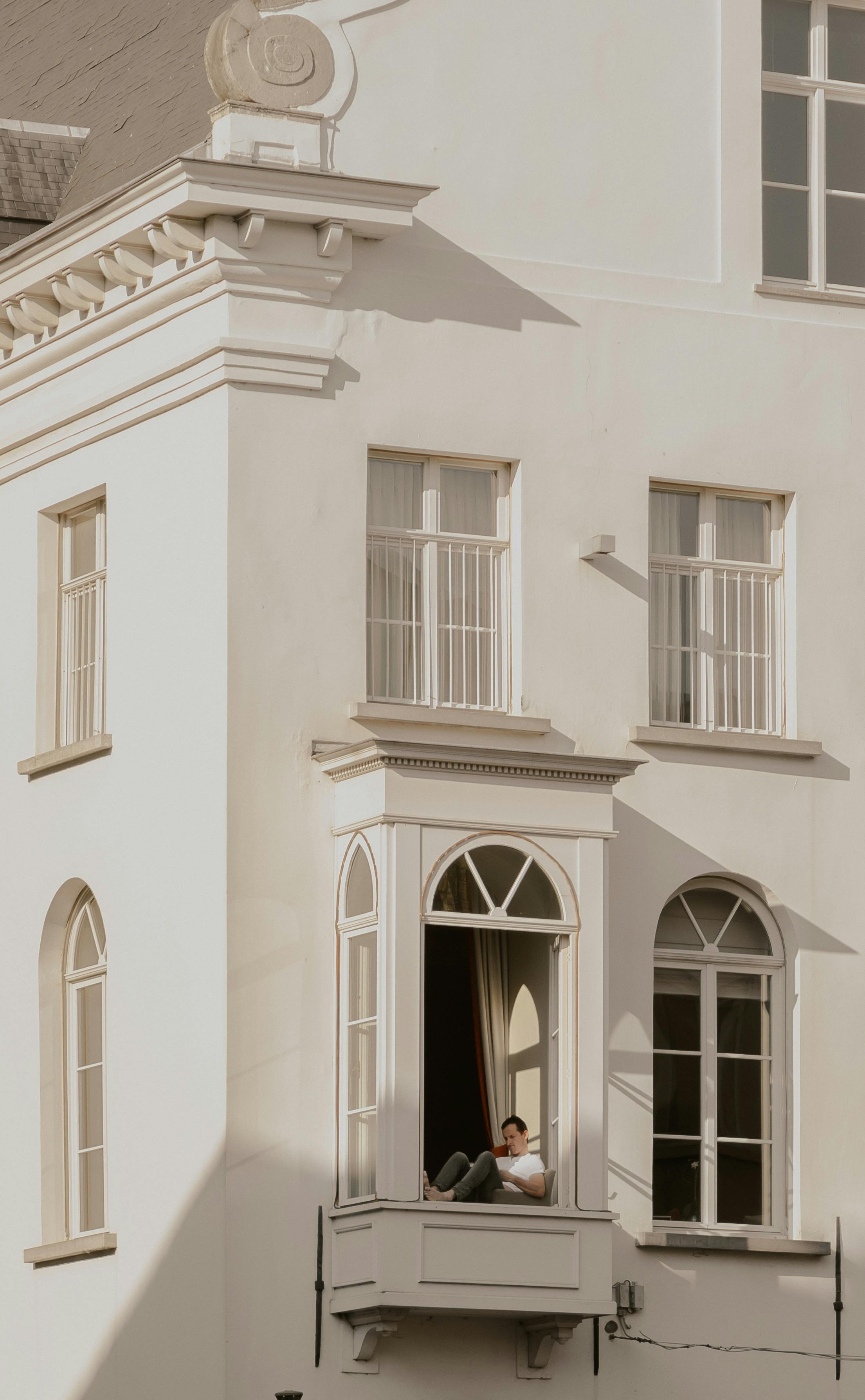 A Man Sitting by the Window · Free Stock Photo