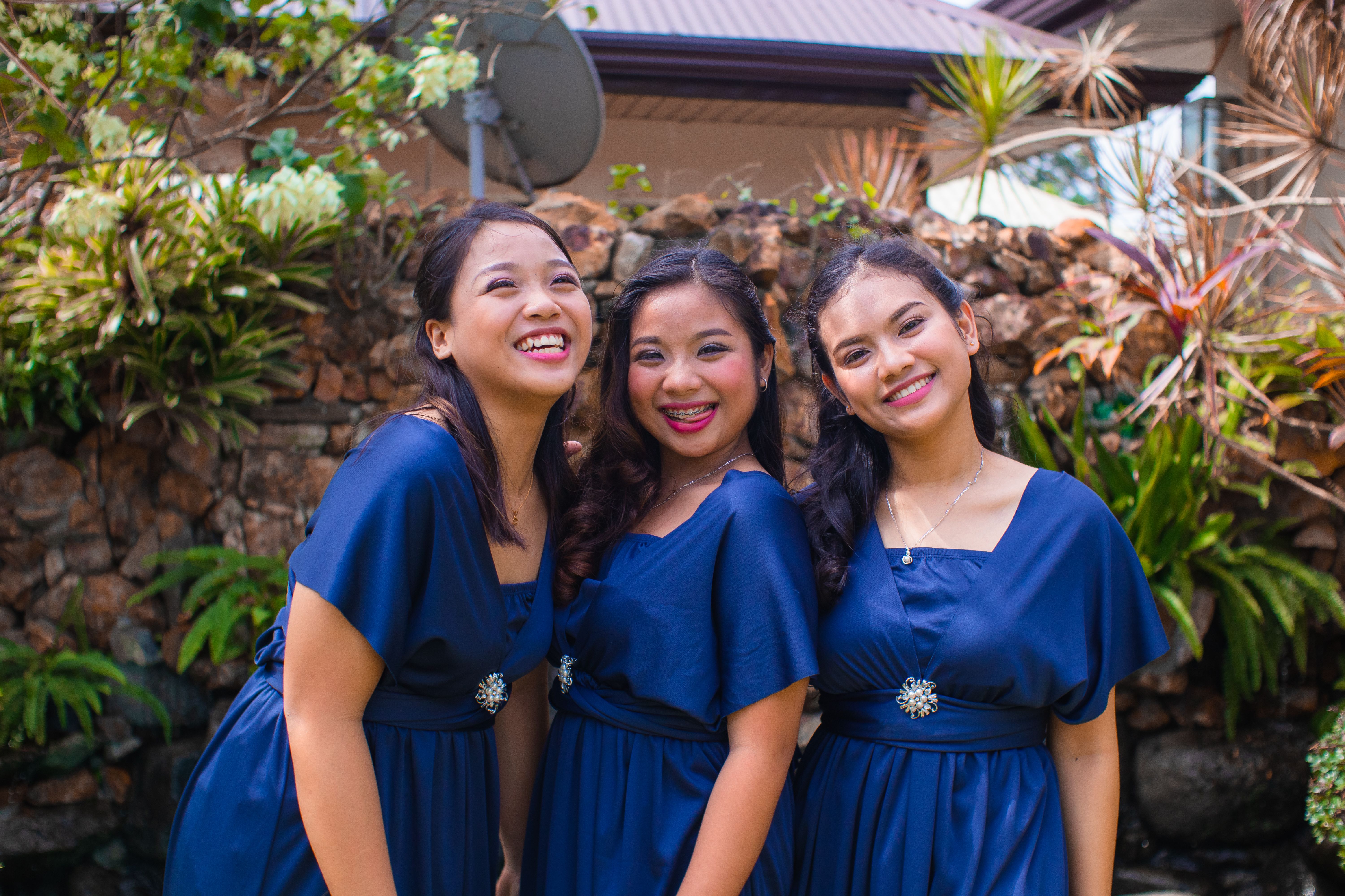 Three Women Wearing Blue Drees · Free Stock Photo