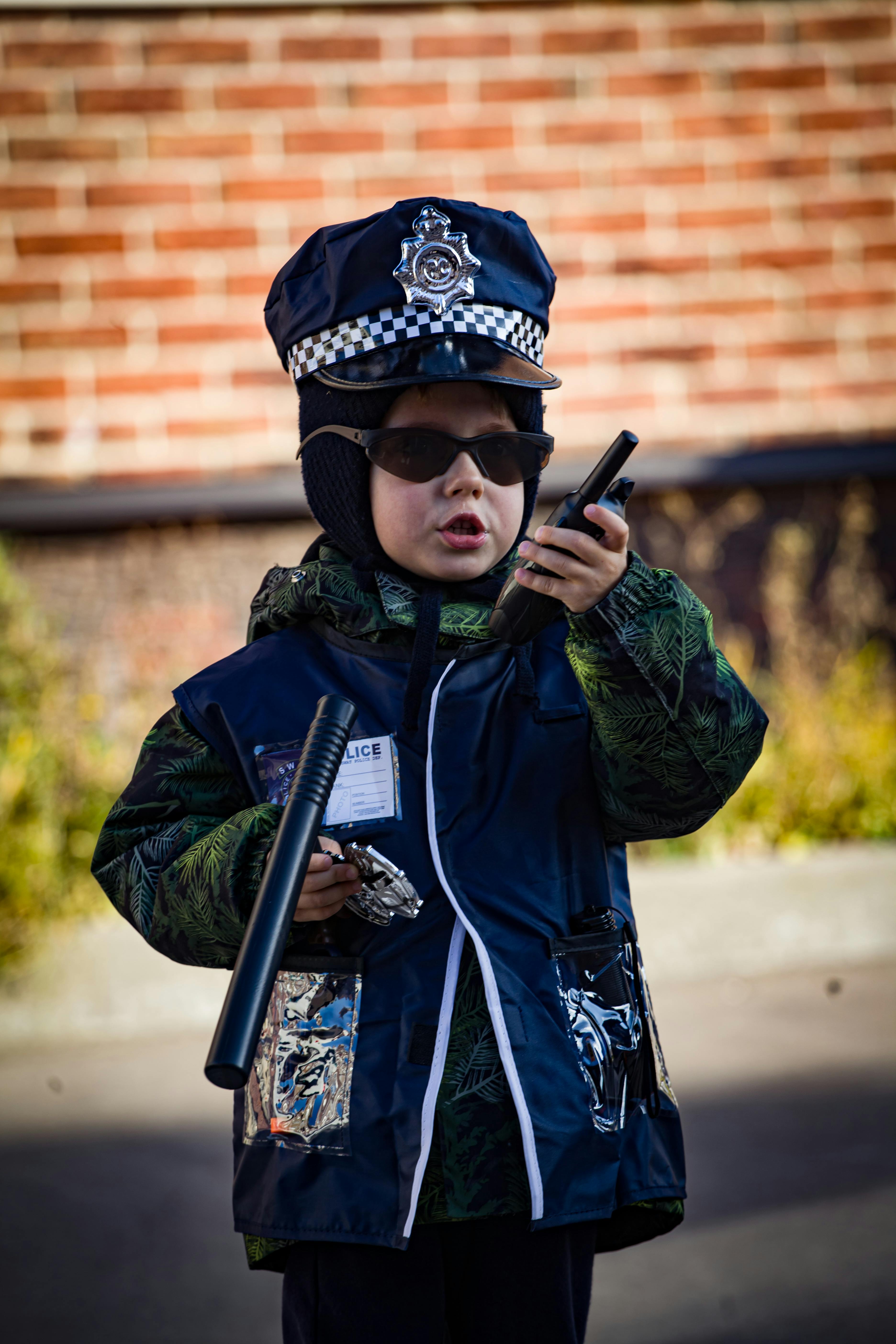 A Boy Dressed as a Police Officer · Free Stock Photo