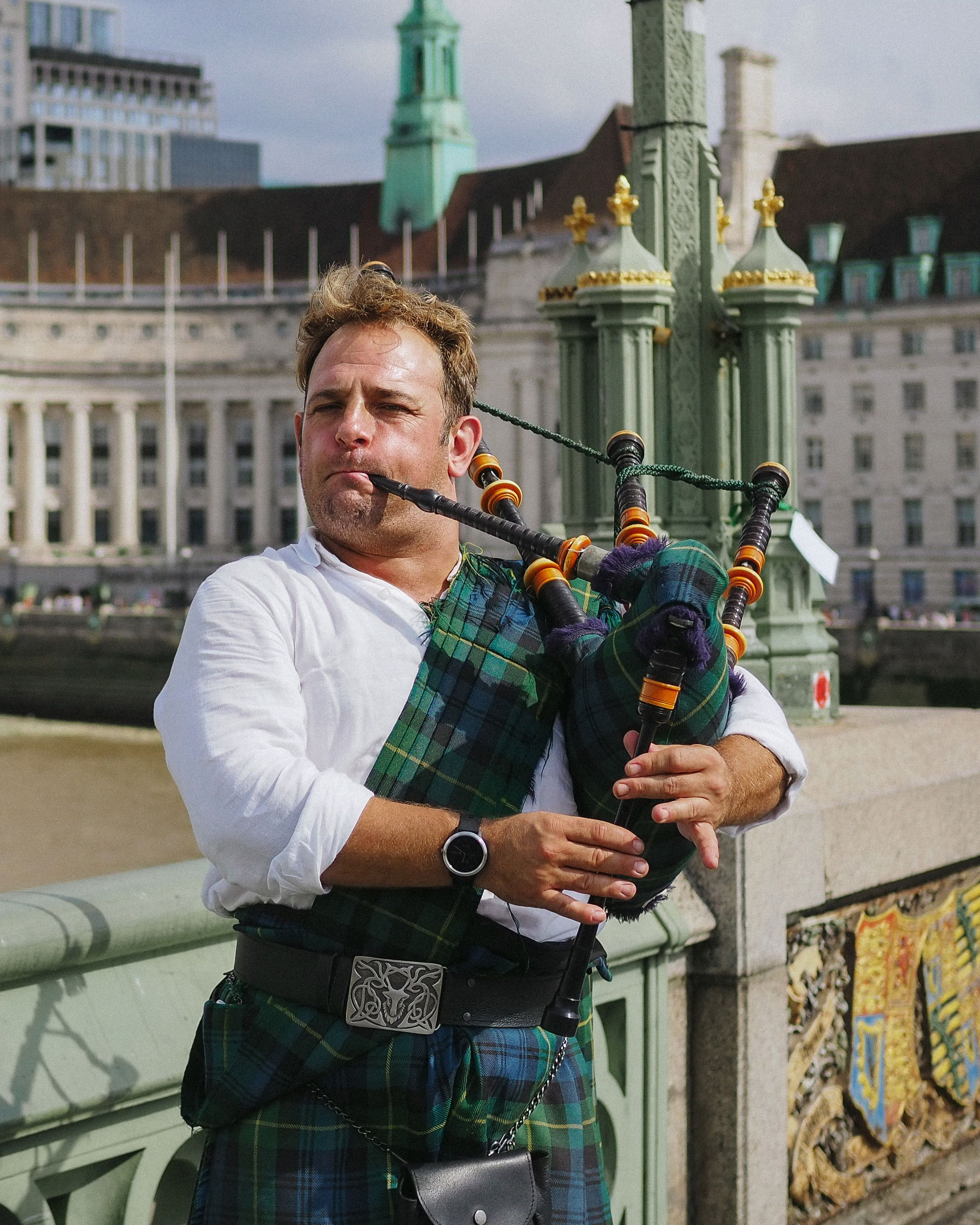 Man Playing Bagpipes in Traditional Plaid Skirt · Free Stock Photo
