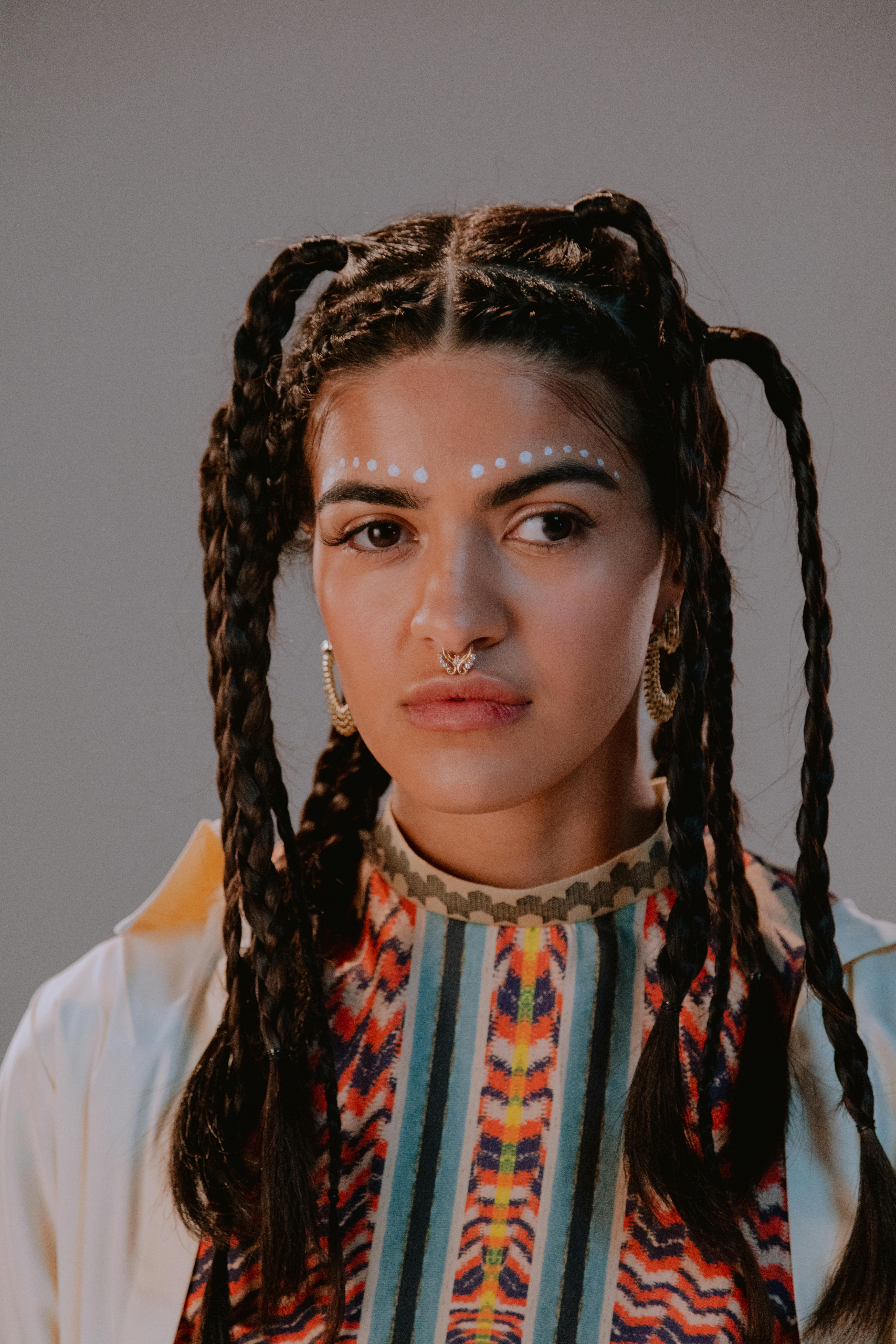 A Beautiful Woman with Dots above Her Eyebrows · Free Stock Photo