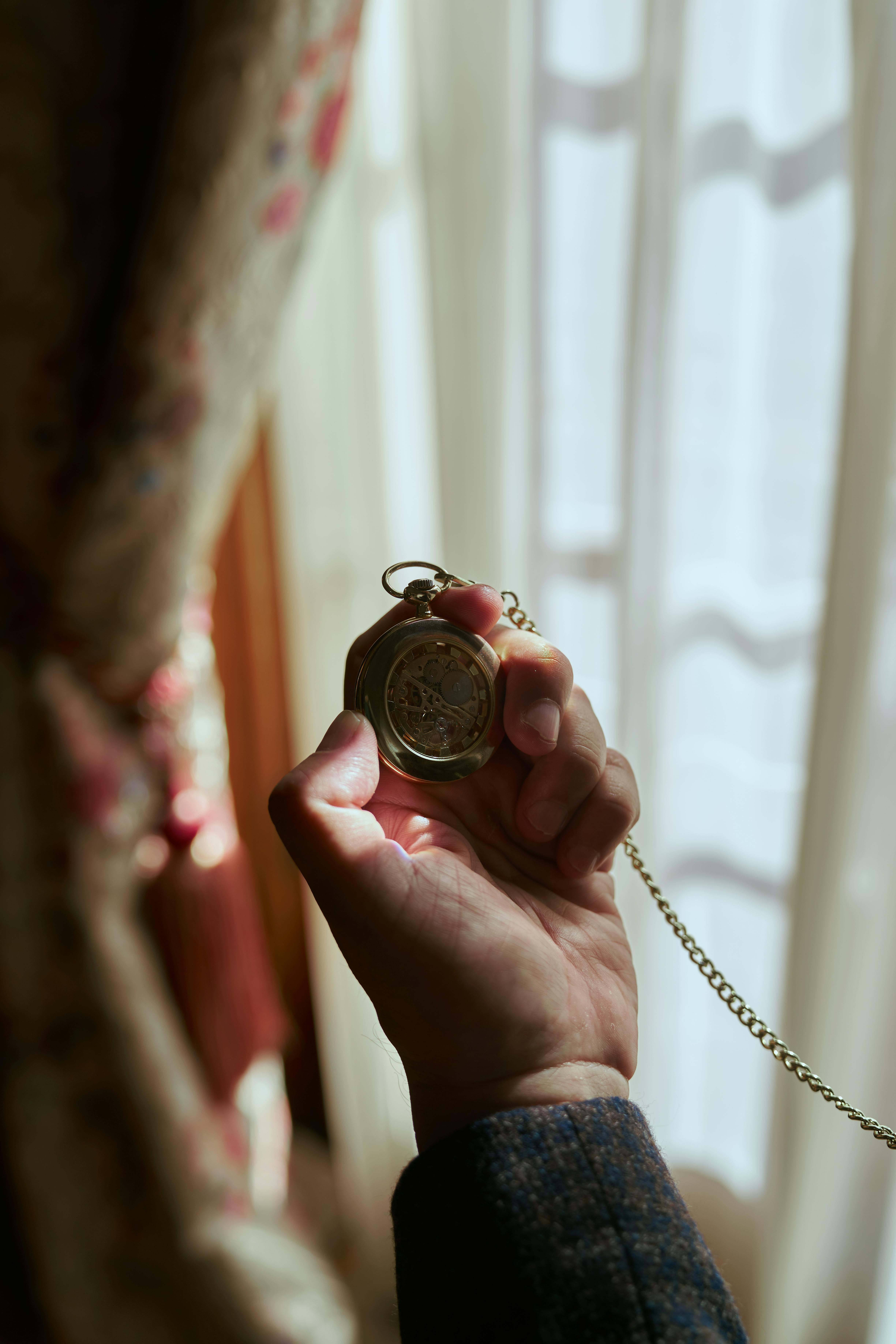 Hand Holding an Old-fashioned Watch · Free Stock Photo
