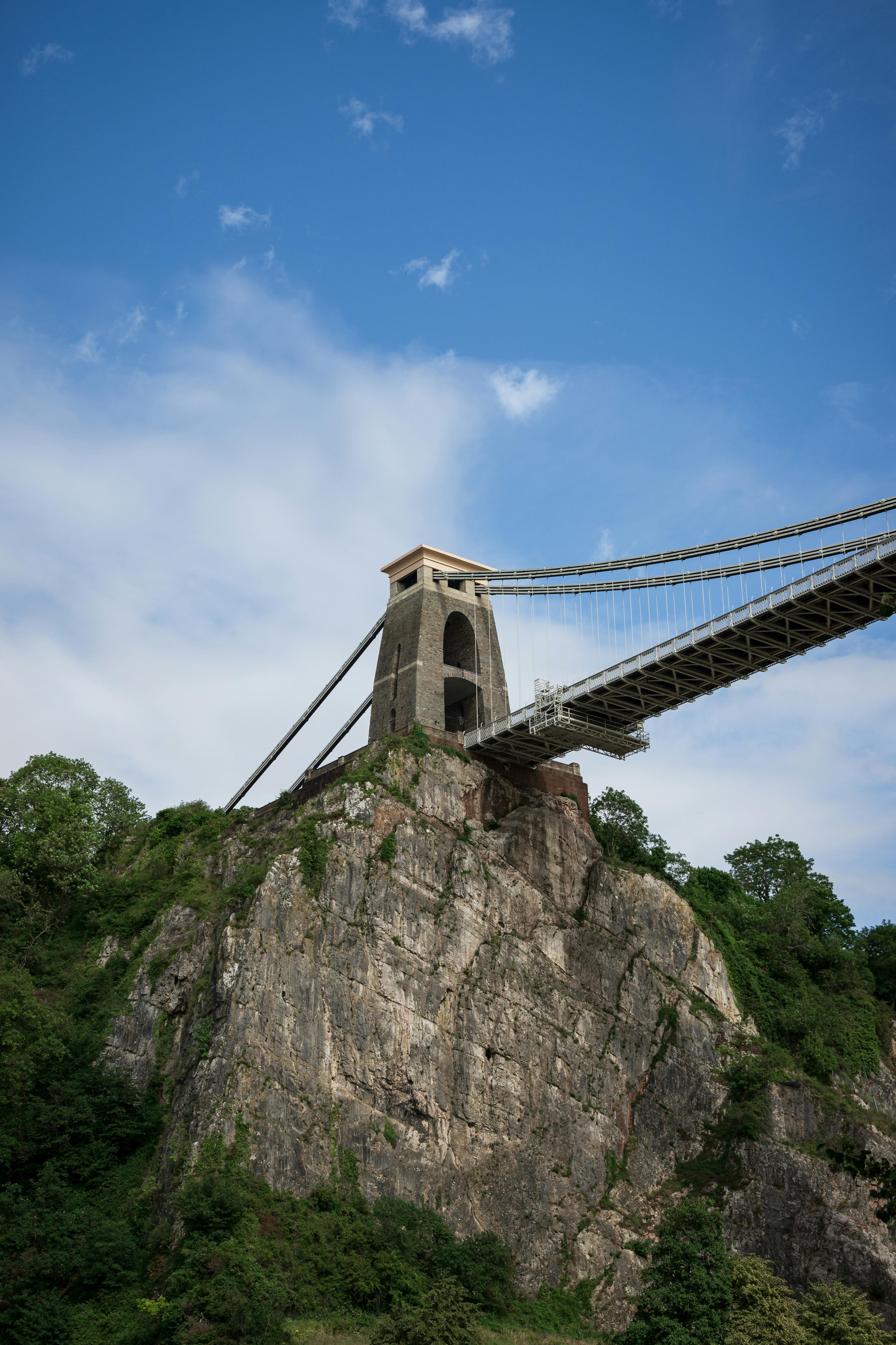 White Bridge on Rocky Mountain Under Blue Sky · Free Stock Photo
