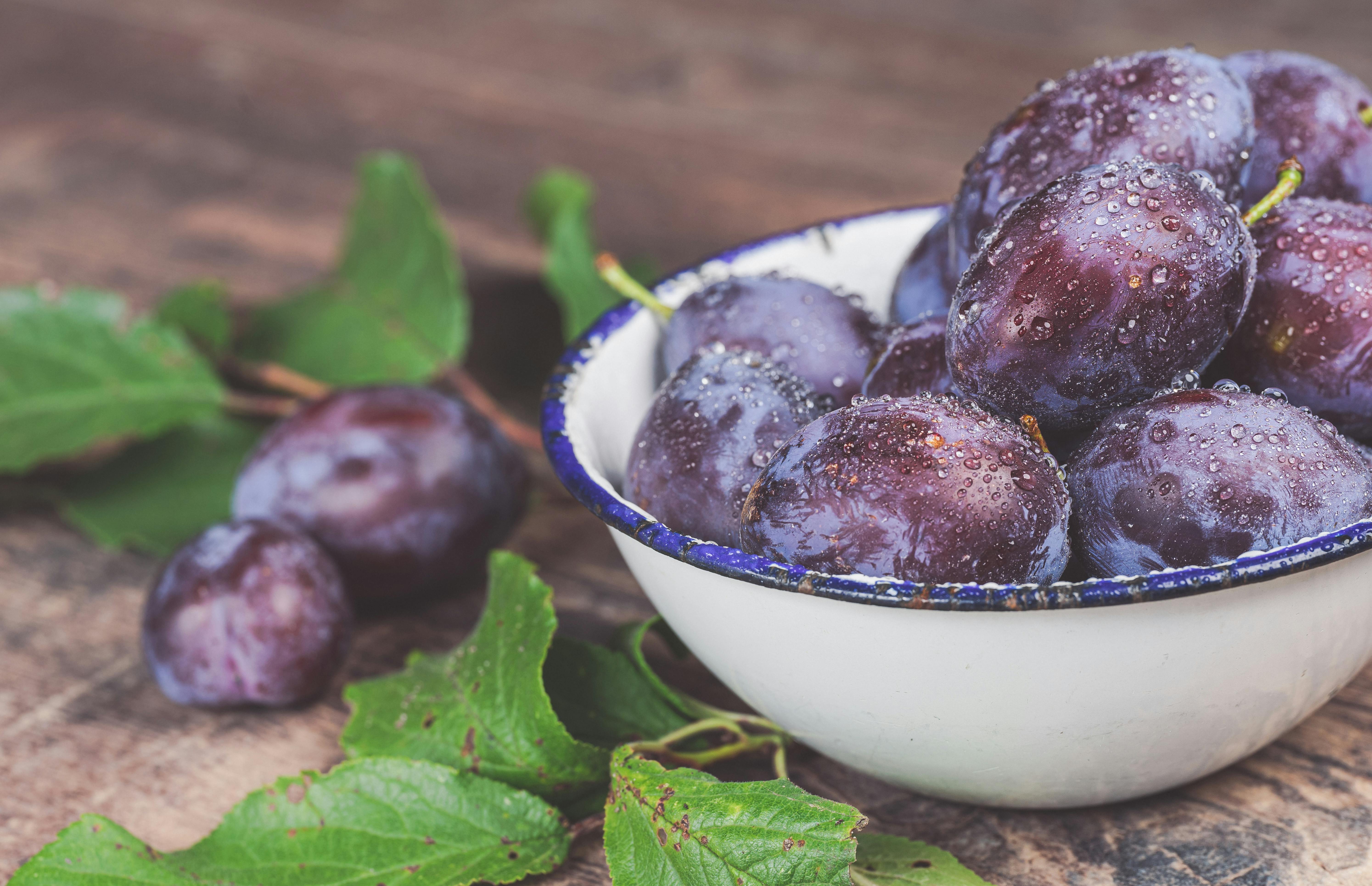 Brown Round Fruits on White Bowl · Free Stock Photo