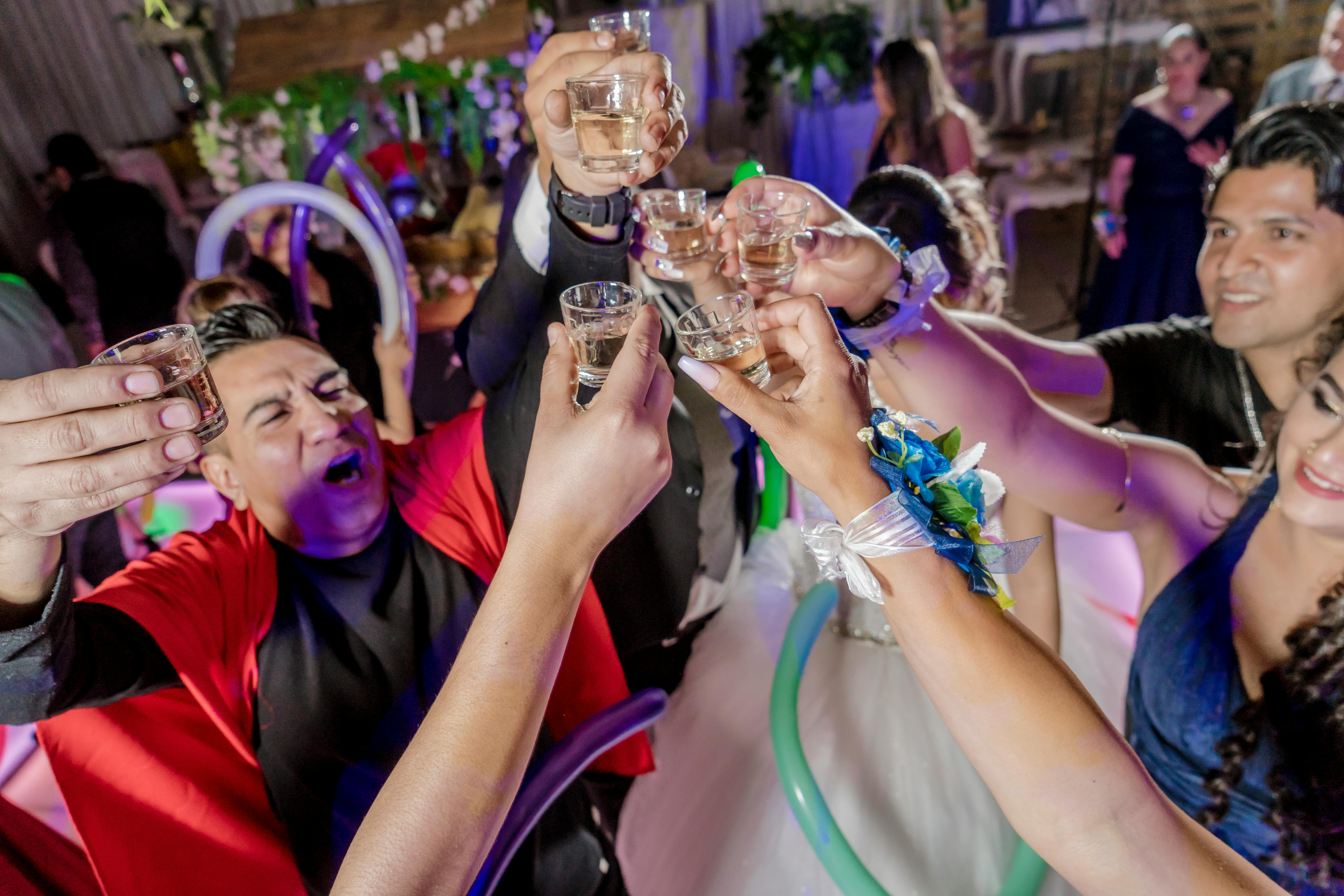 Friends Clinking their Shot Glasses · Free Stock Photo