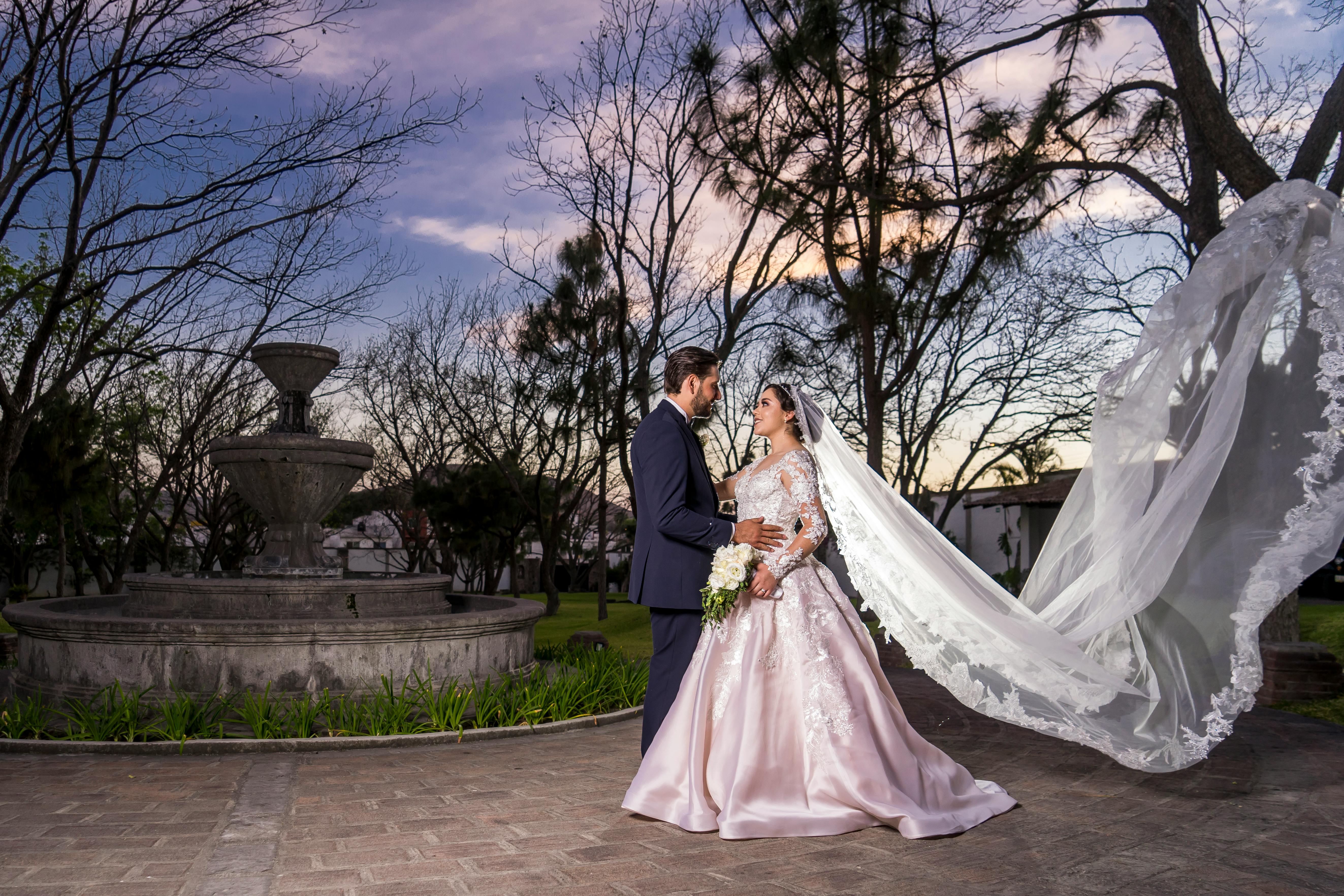Just Married Couple Reflected in Lake · Free Stock Photo