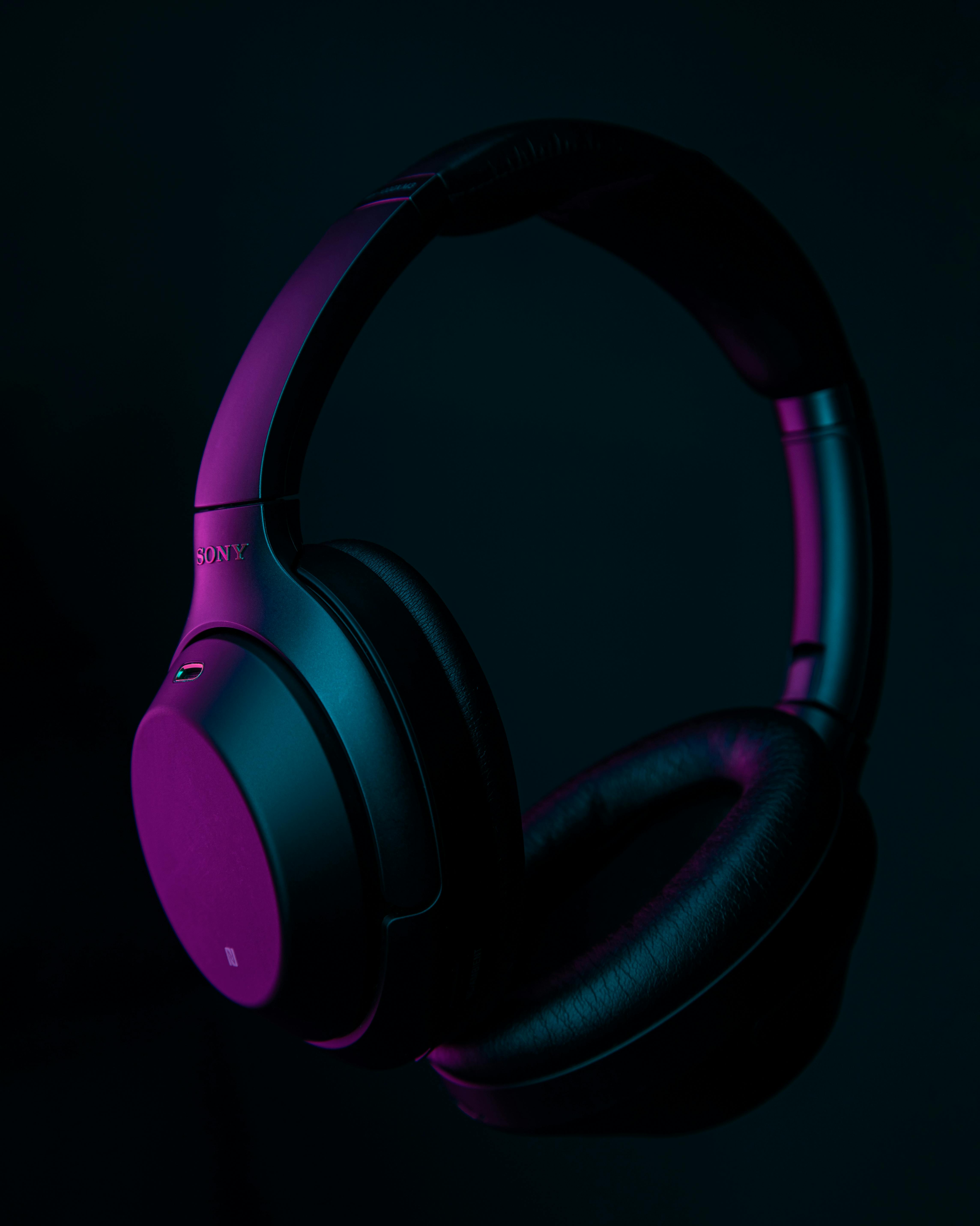 White Earphones On Black Surface · Free Stock Photo