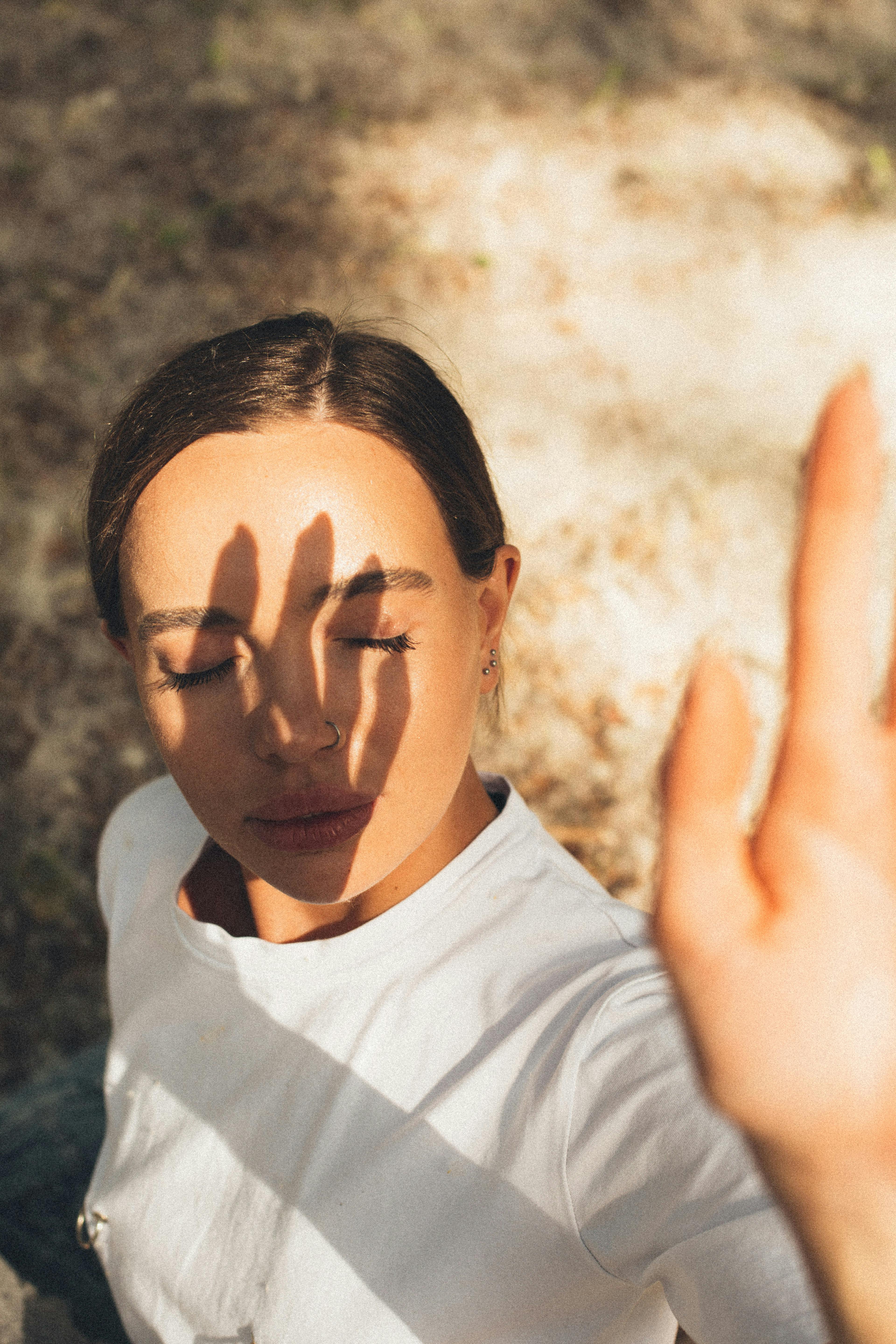 Hand Shadow on Woman Face · Free Stock Photo