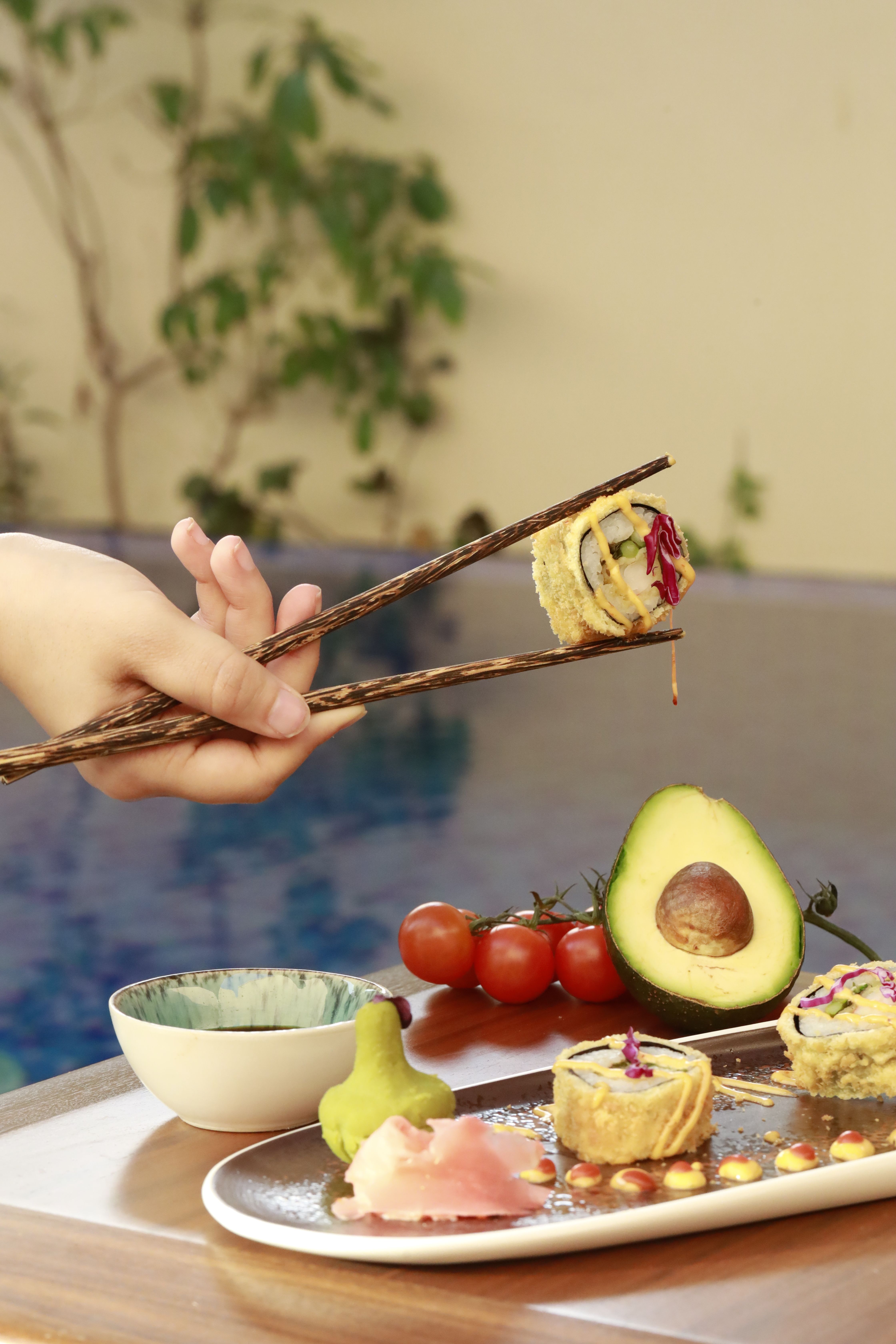 Person Holding Brown Wooden Chopsticks · Free Stock Photo