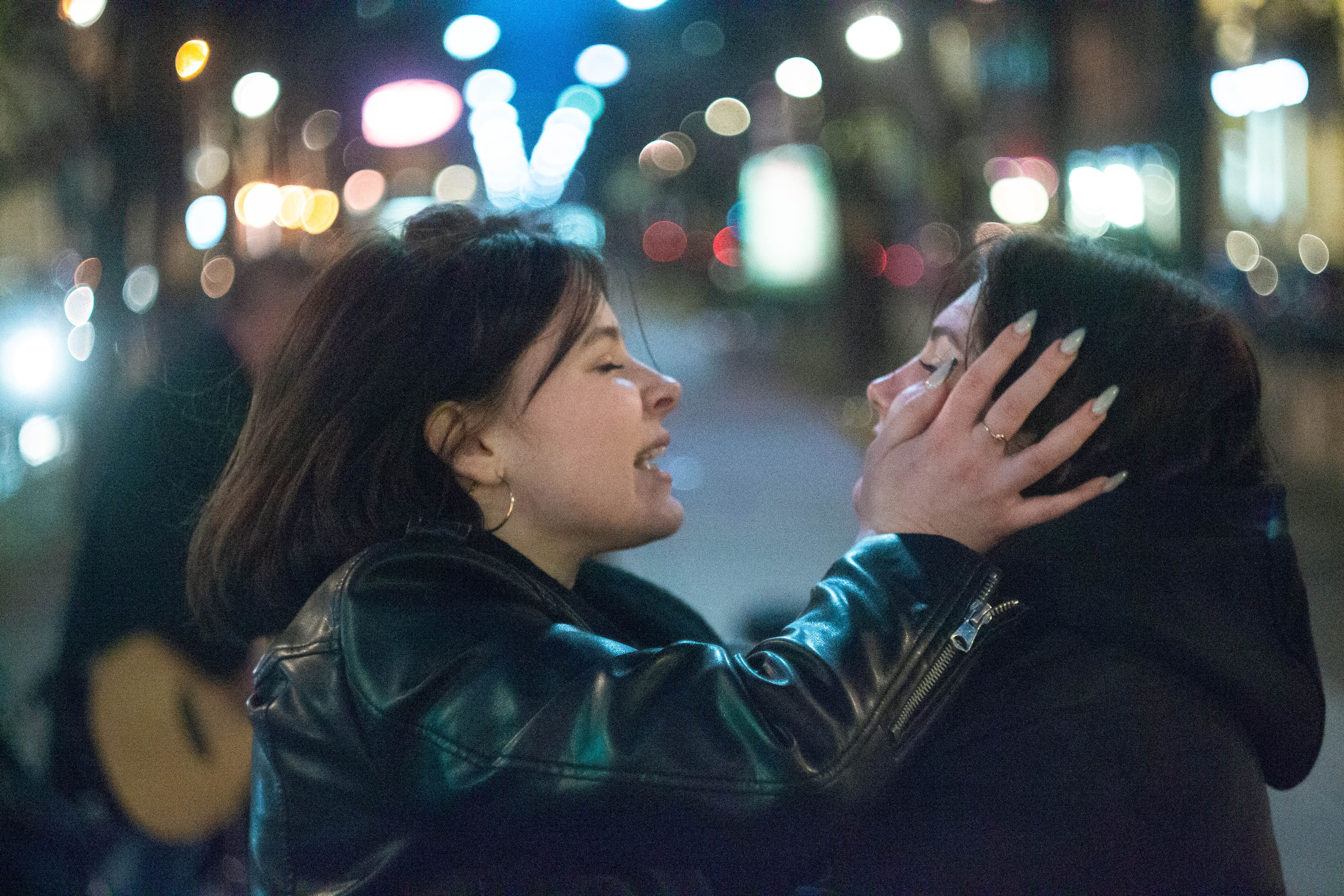 Women Facing Each Other while Standing on the Street · Free Stock Photo
