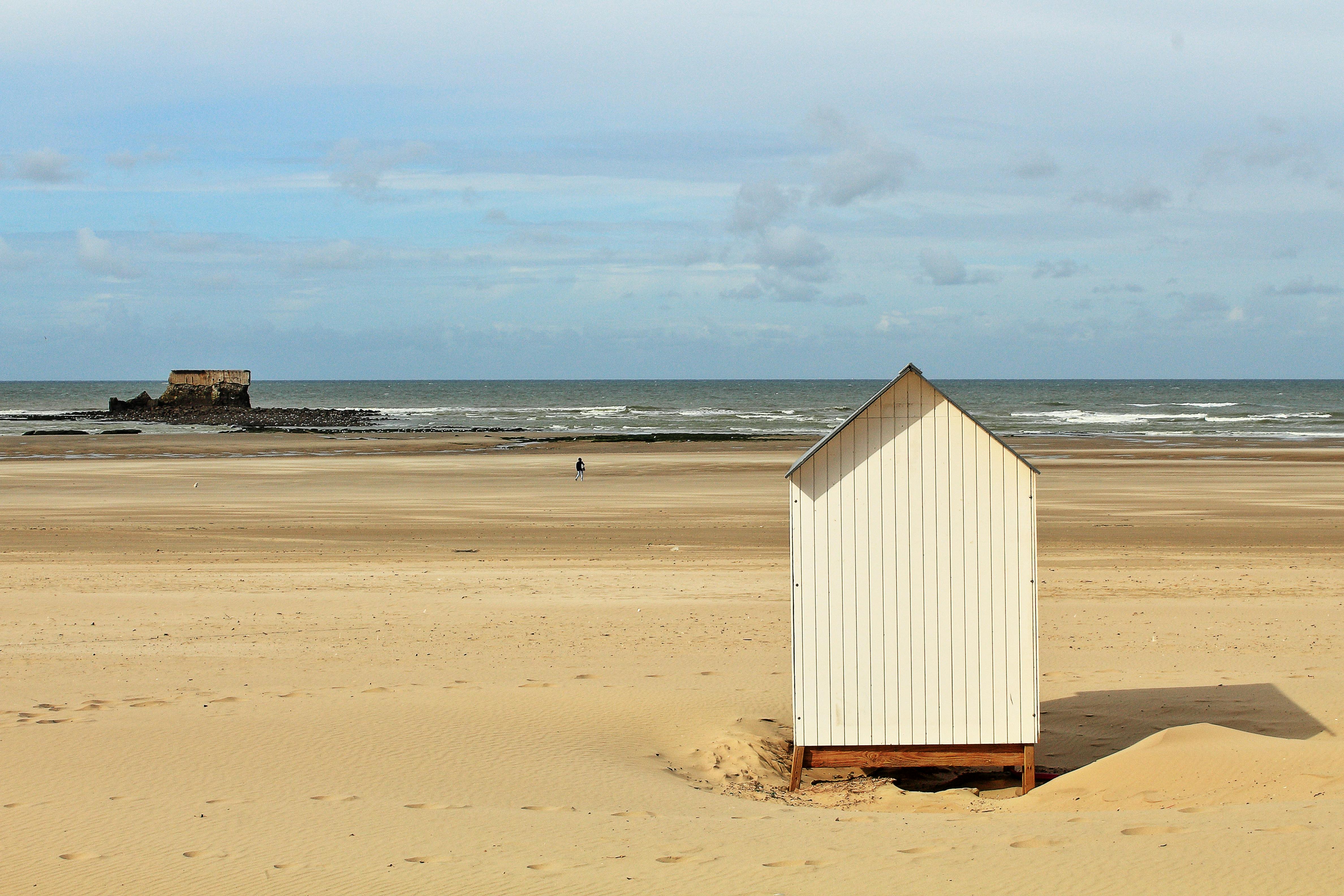 A White Wooden Lifeguard Shack on the Shore · Free Stock Photo