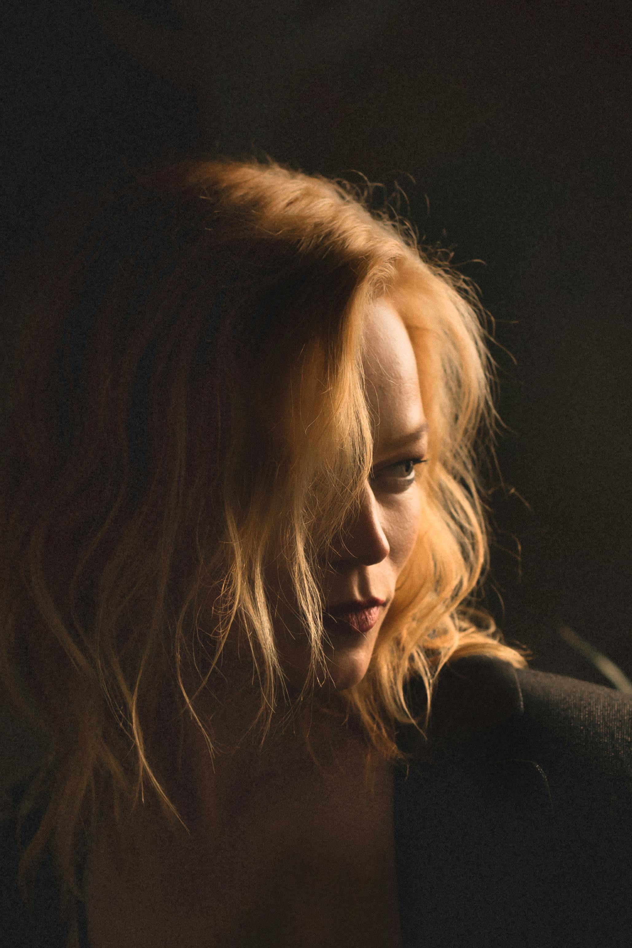 Woman Removing Her Coat · Free Stock Photo