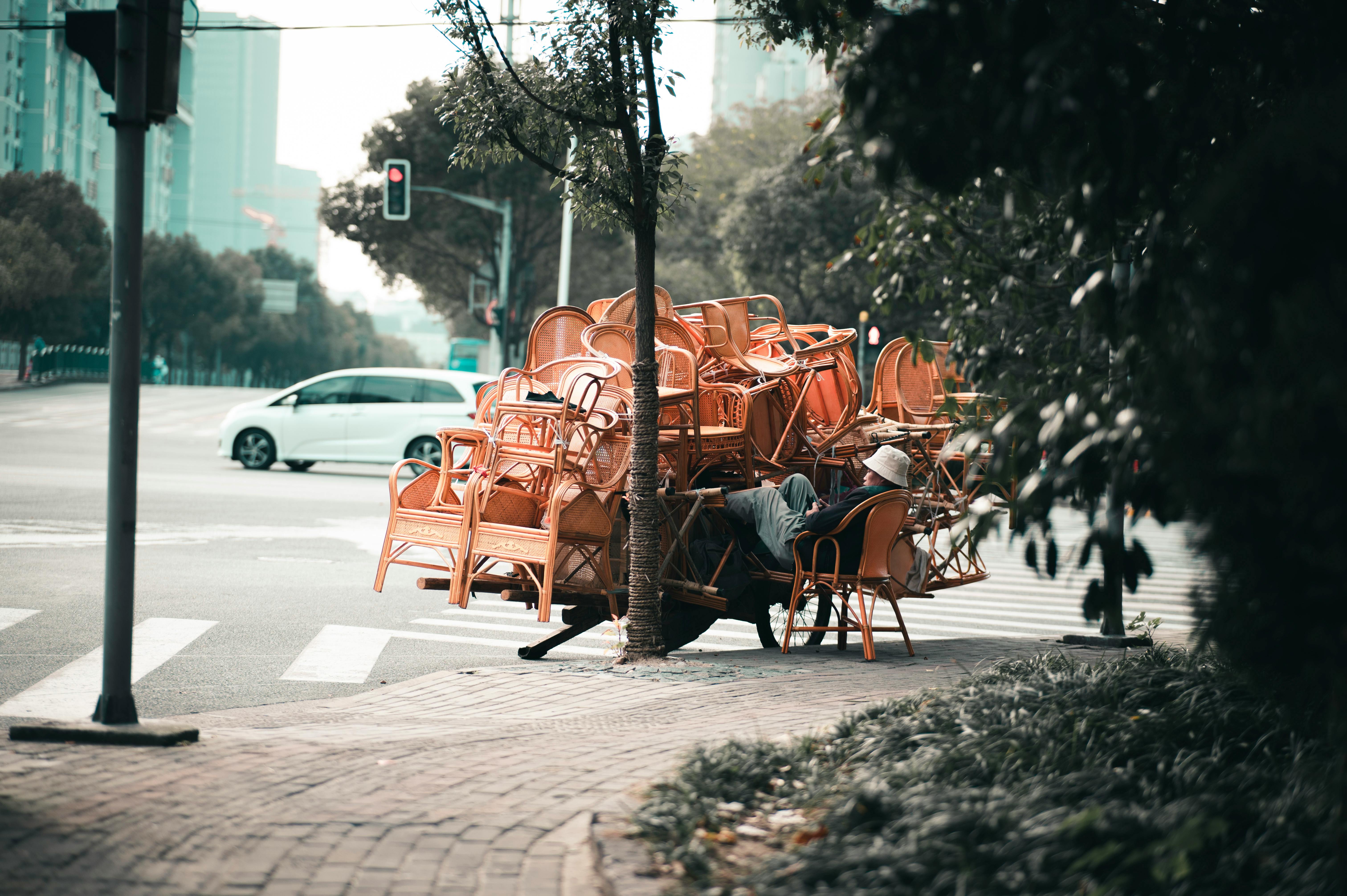 Photo of a Vendor Selling Wooden Chairs · Free Stock Photo