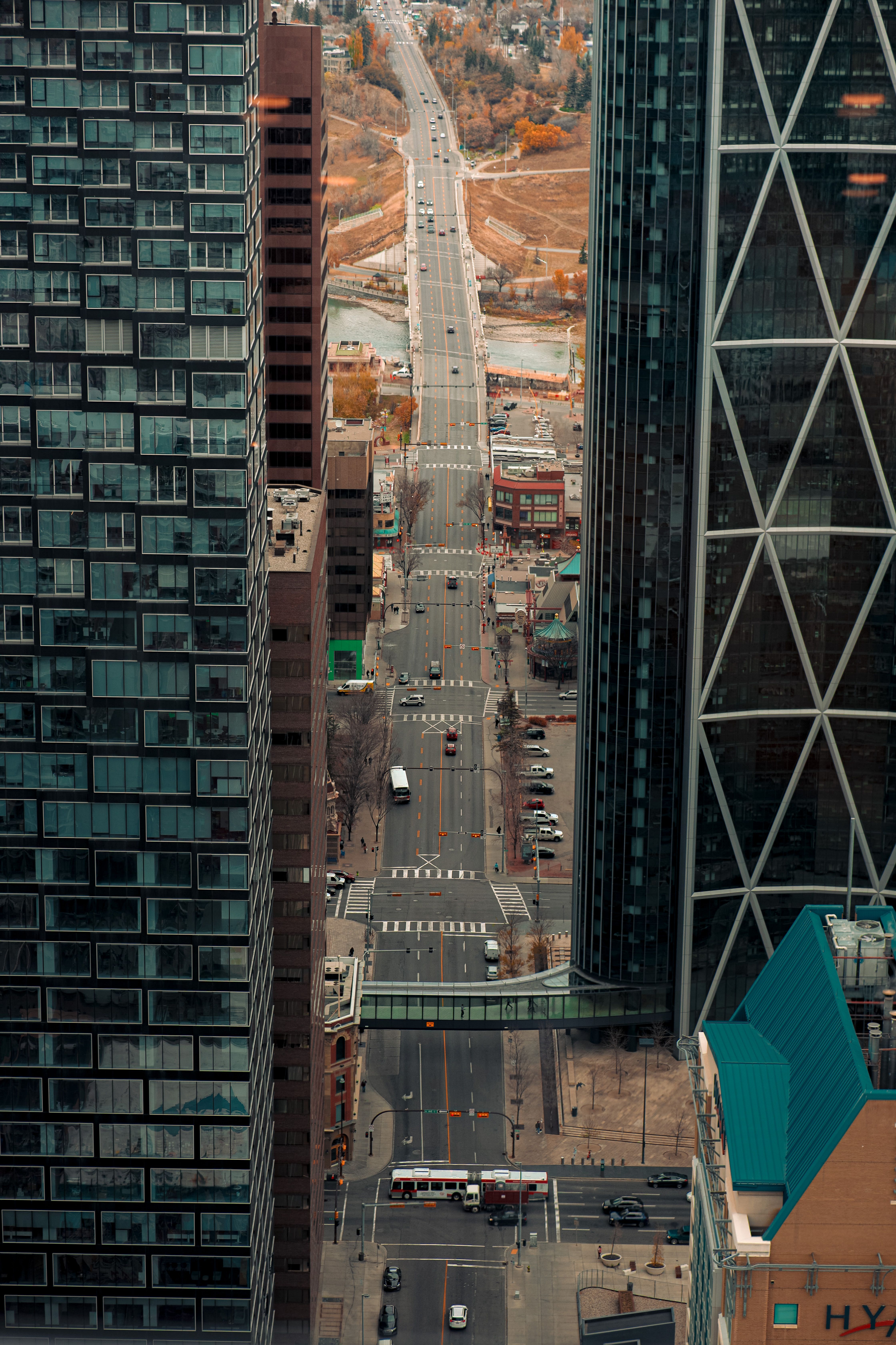 An Aerial View of a Concrete Road Between City Buildings · Free Stock Photo