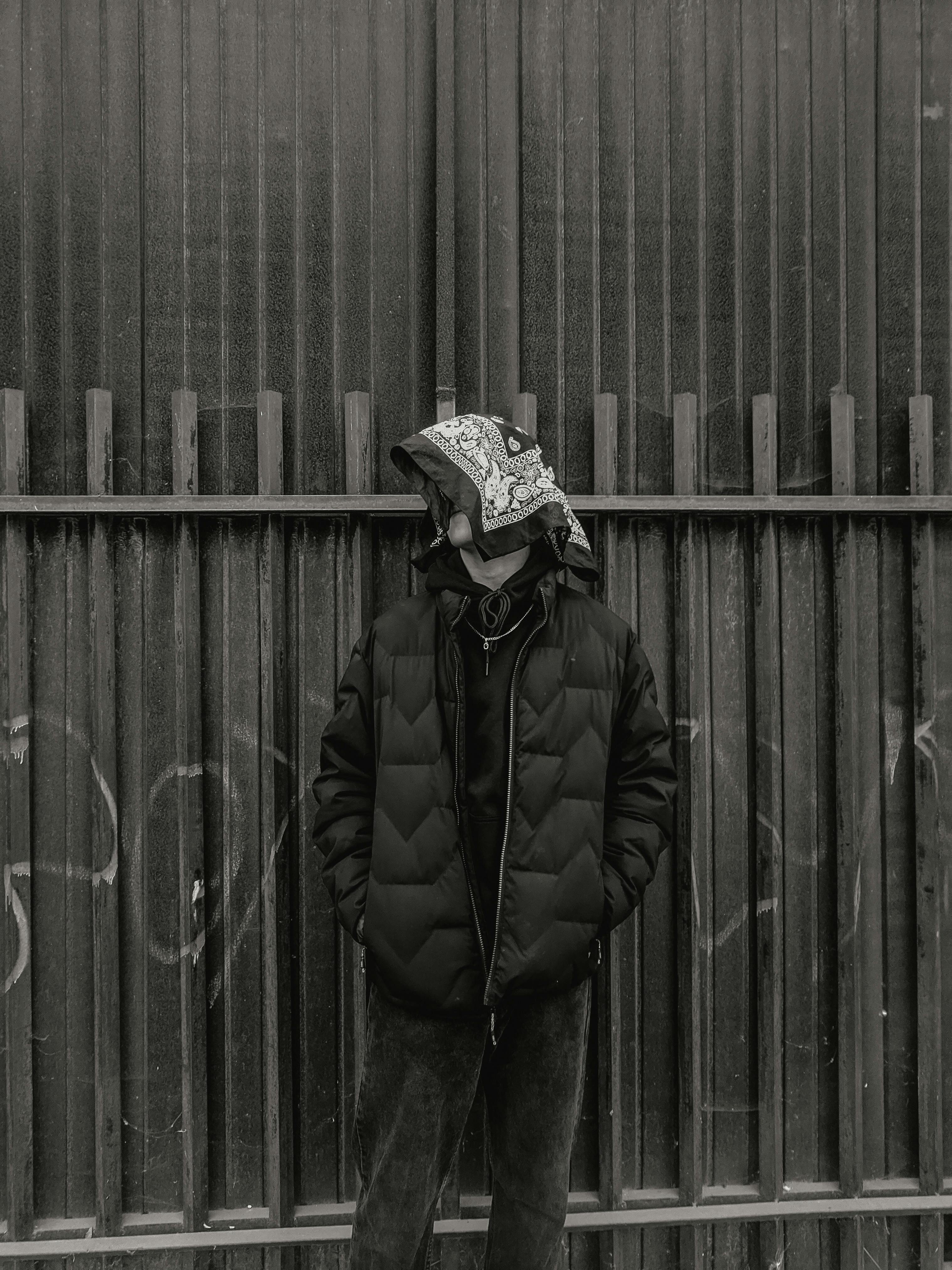 A Man in Black Jacket with a Handkerchief Over his Head · Free Stock Photo