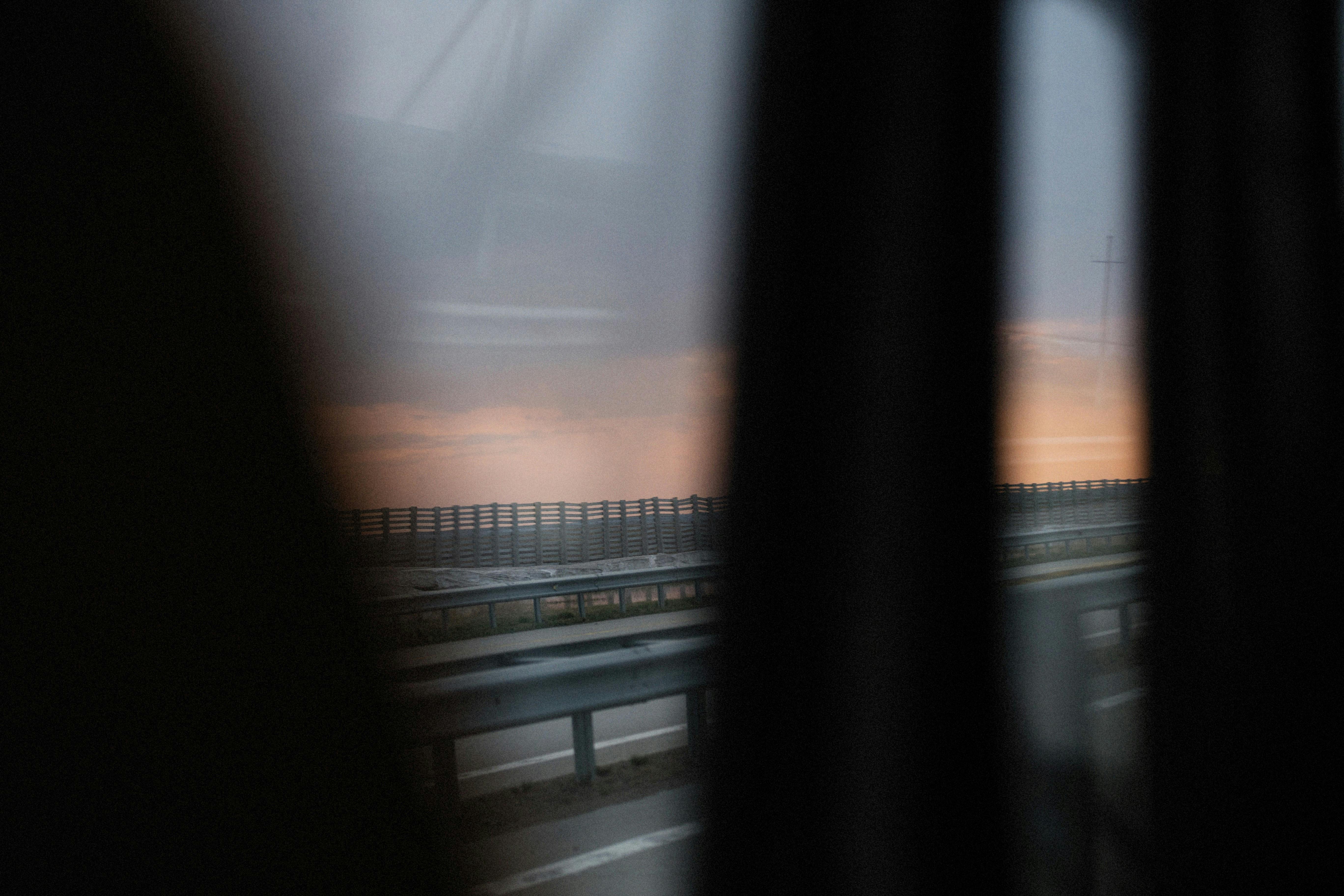Close up of Barrier on Road behind Car Windows · Free Stock Photo