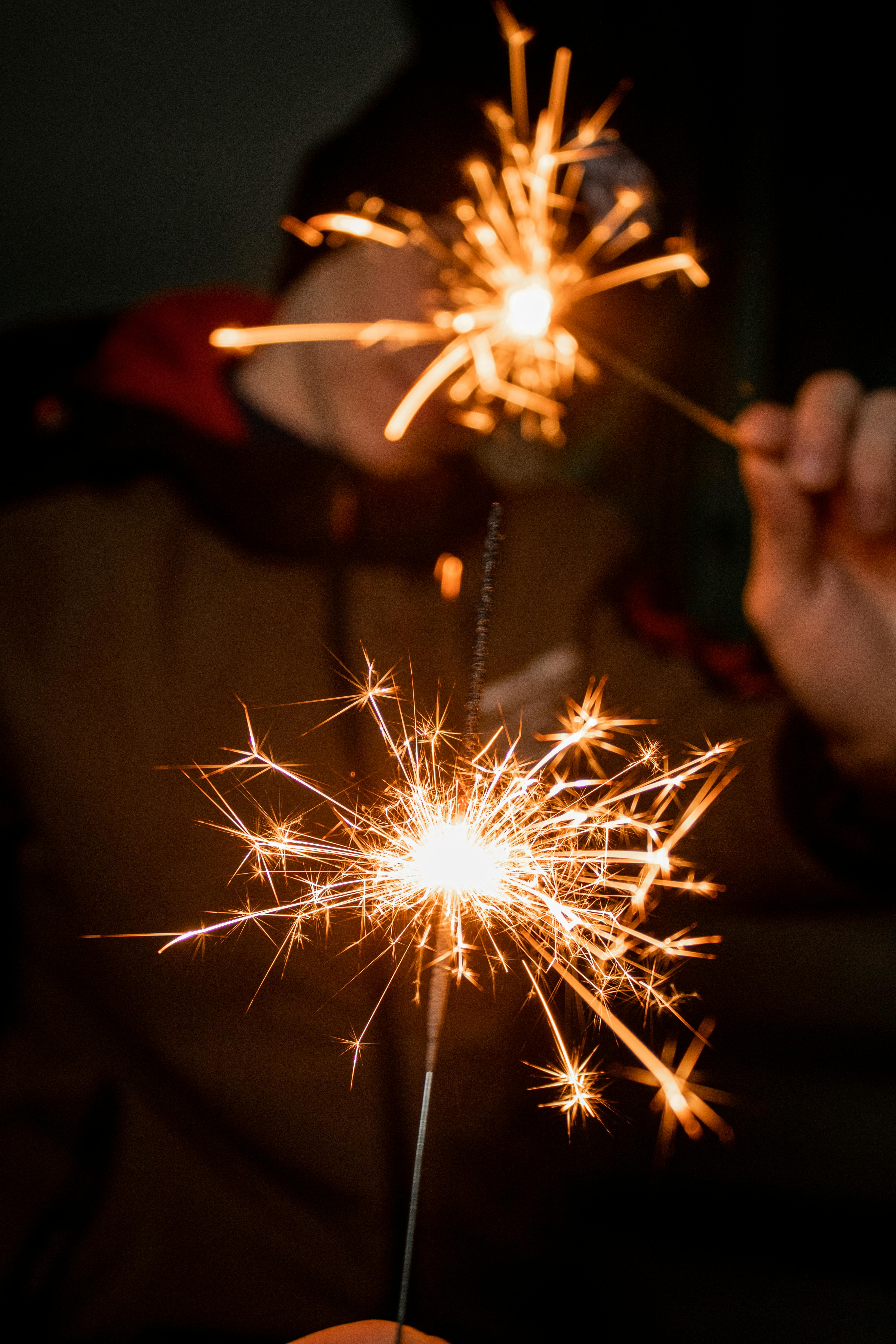 Person Holding A Sparkler in Macro Photography · Free Stock Photo