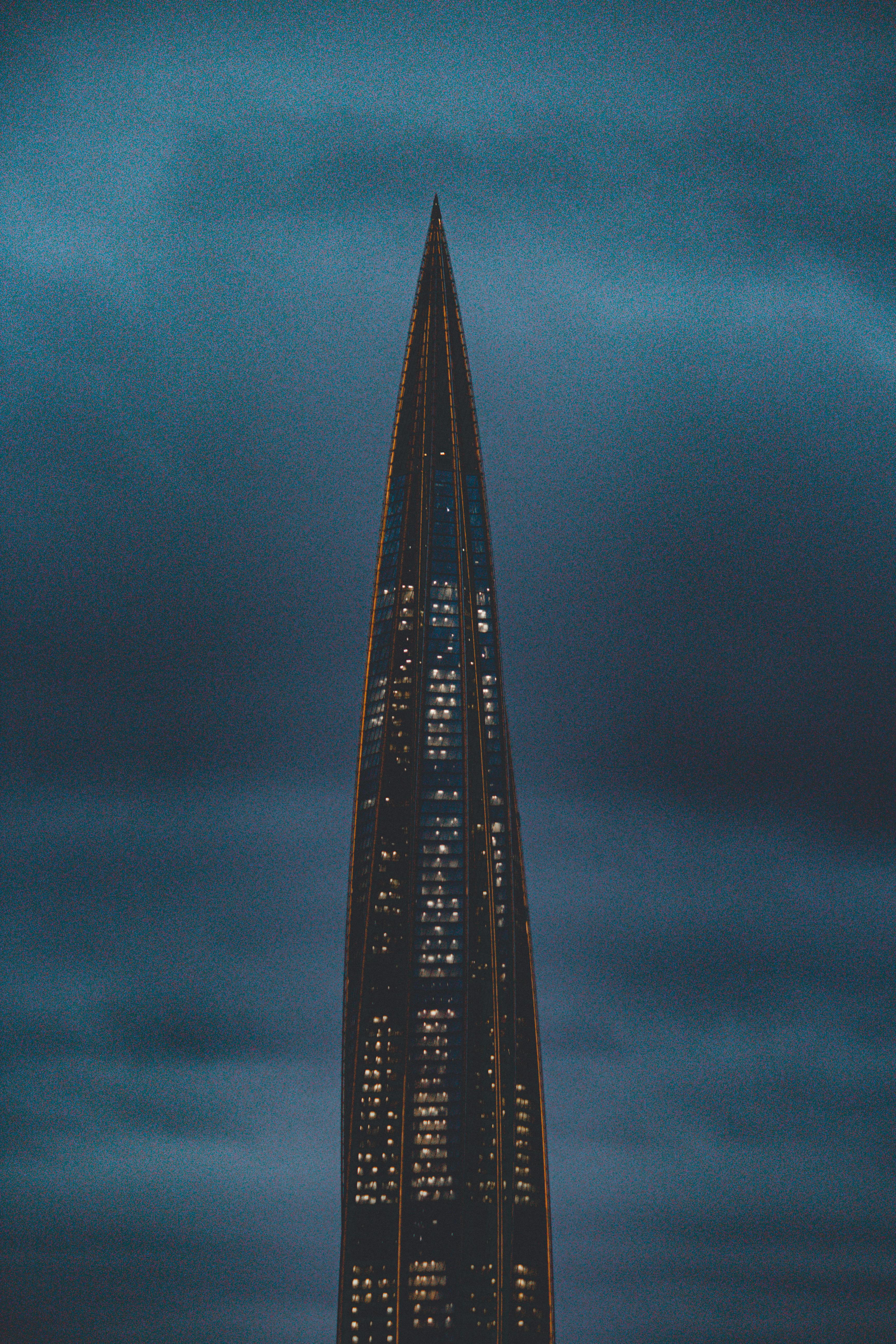 Illuminated Skyscraper on Night Sky Background · Free Stock Photo