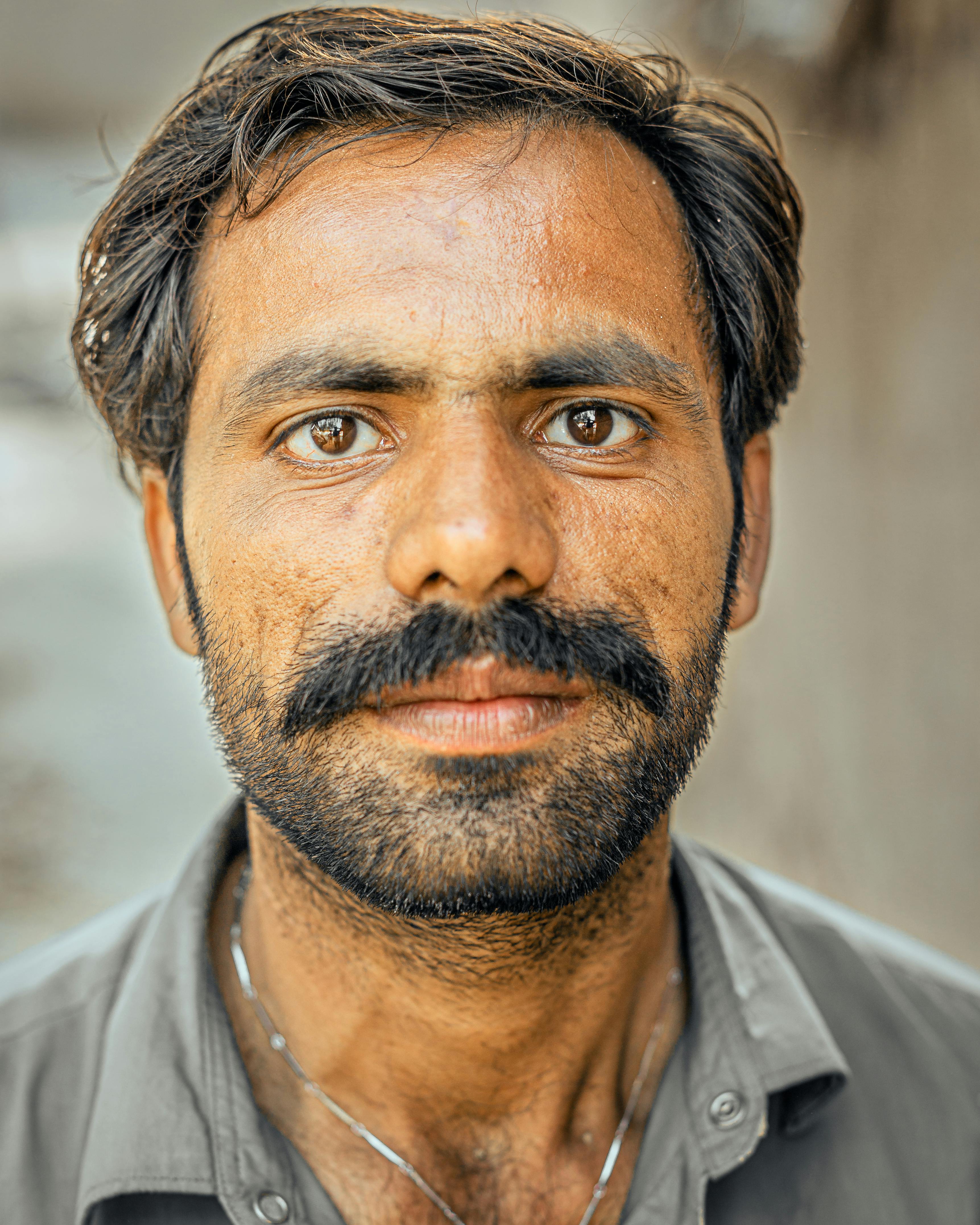 Portrait of a Man with a Mustache · Free Stock Photo