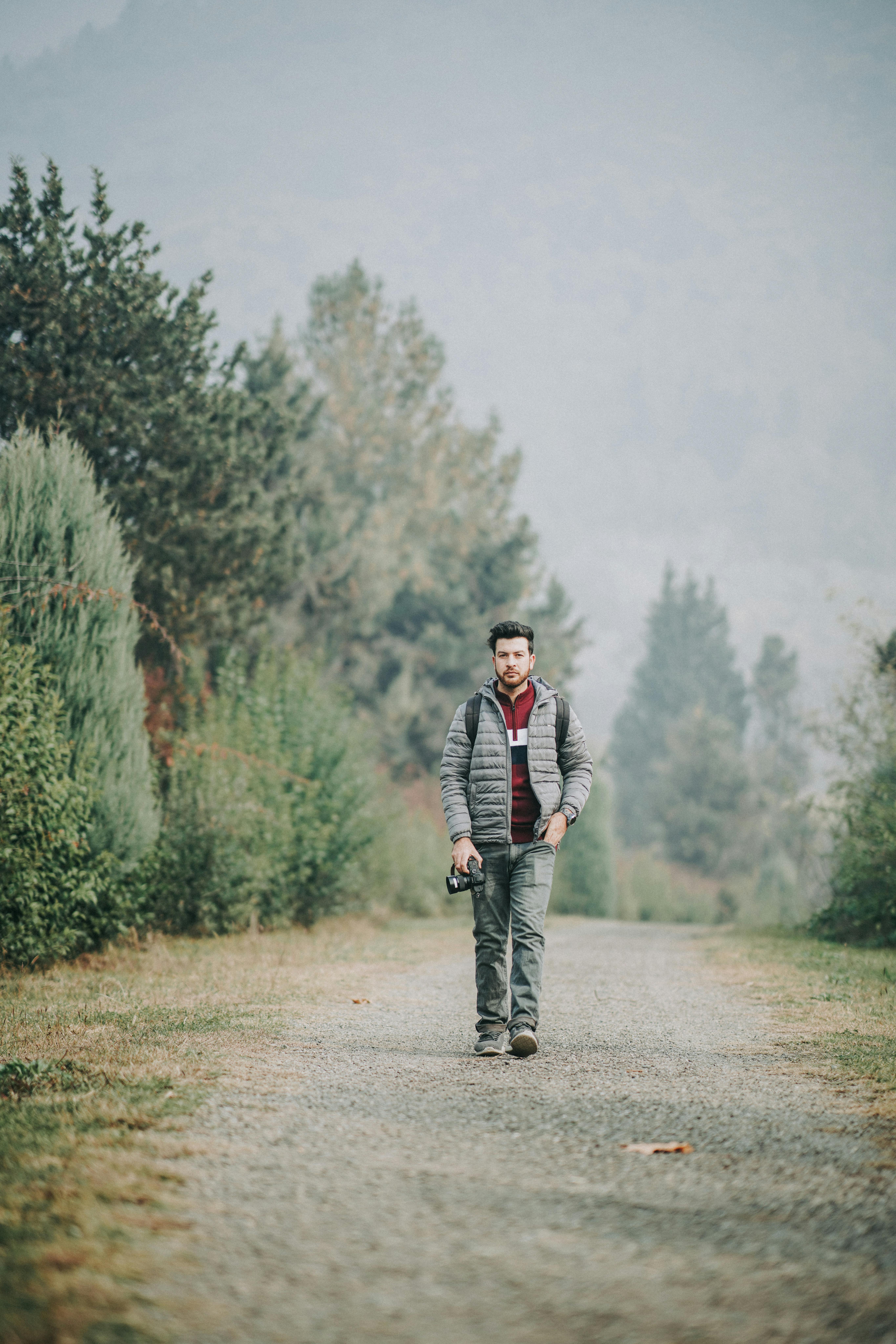Man Standing in the Middle of Empty Road · Free Stock Photo