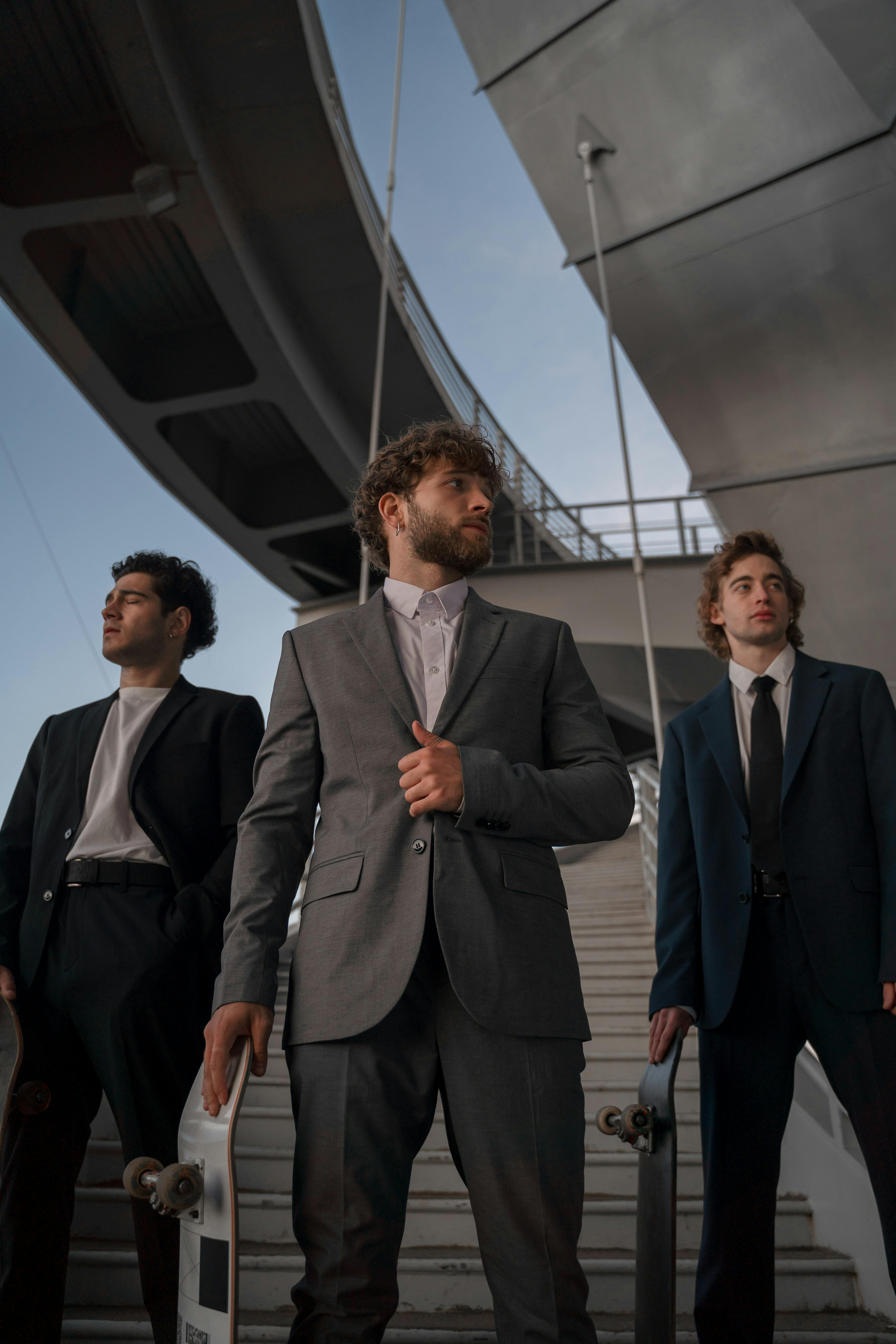 A Couple in Formal Wear Standing om Stair · Free Stock Photo