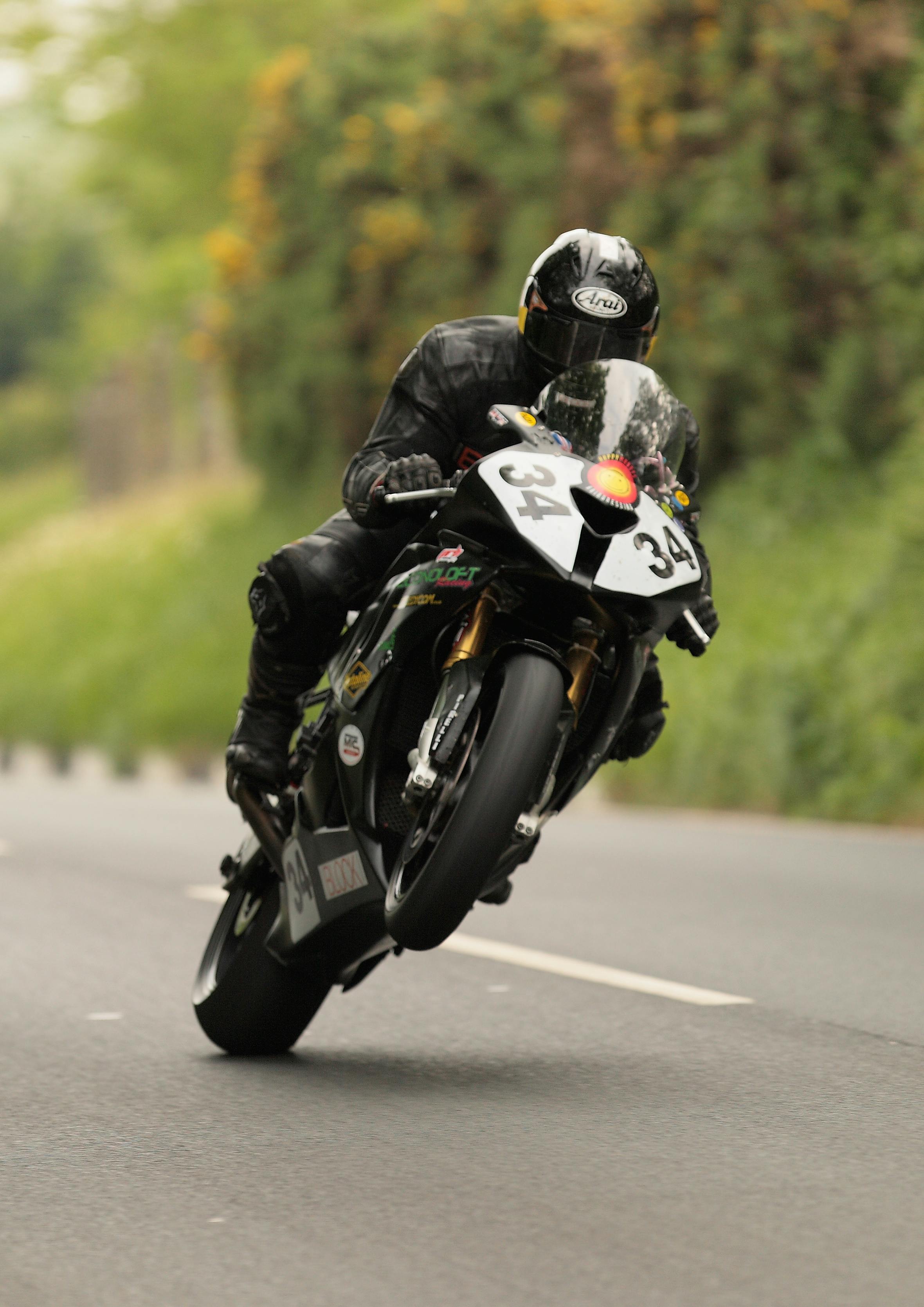Man Riding on a Motorbike Among Trees · Free Stock Photo