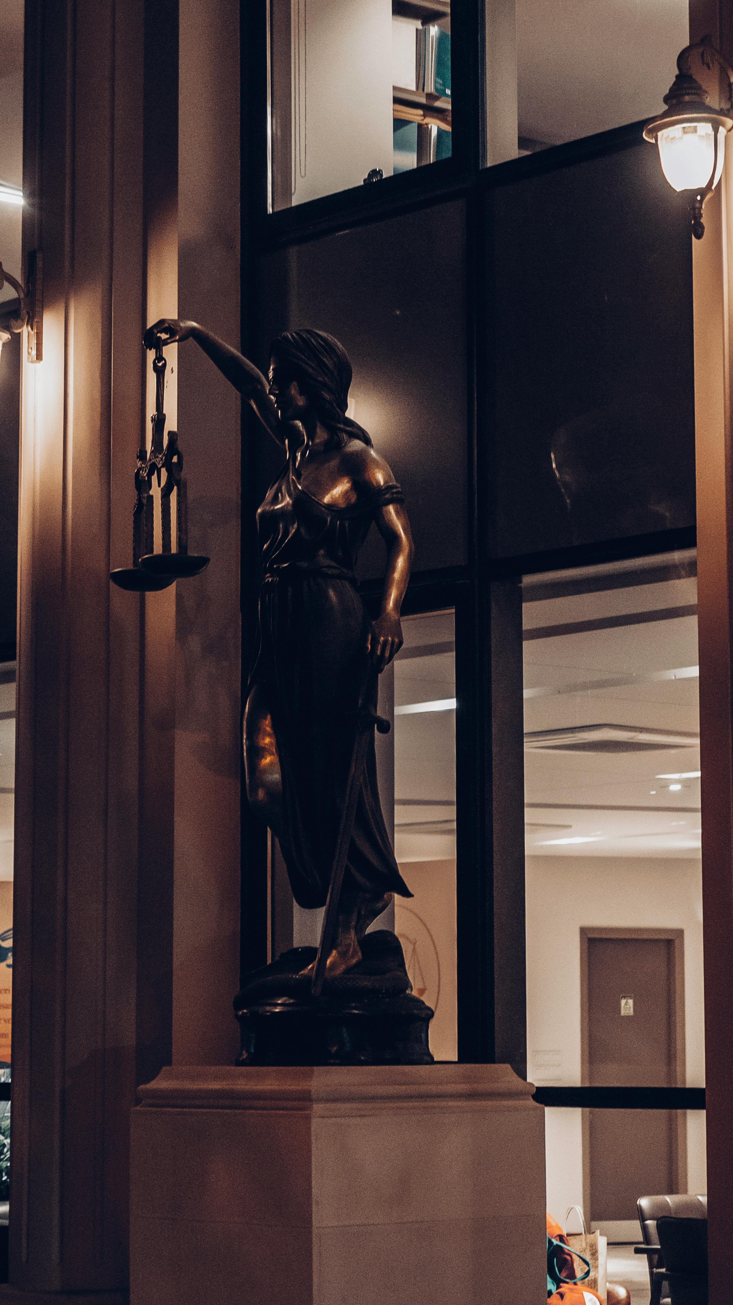 Close-up Photo of a Lady Justice Statuette · Free Stock Photo