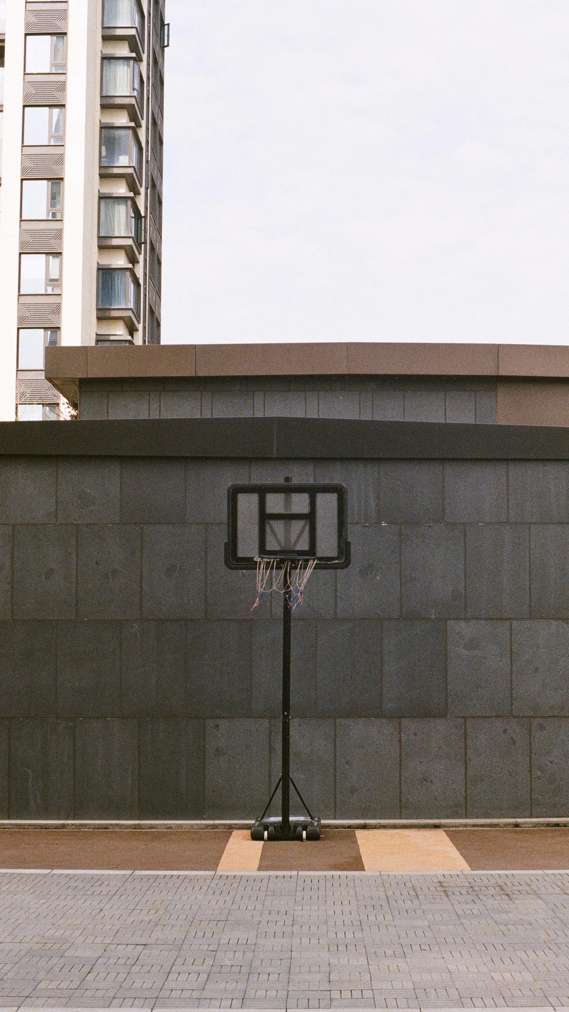 A Basketball Hoop on a Concrete Wall · Free Stock Photo