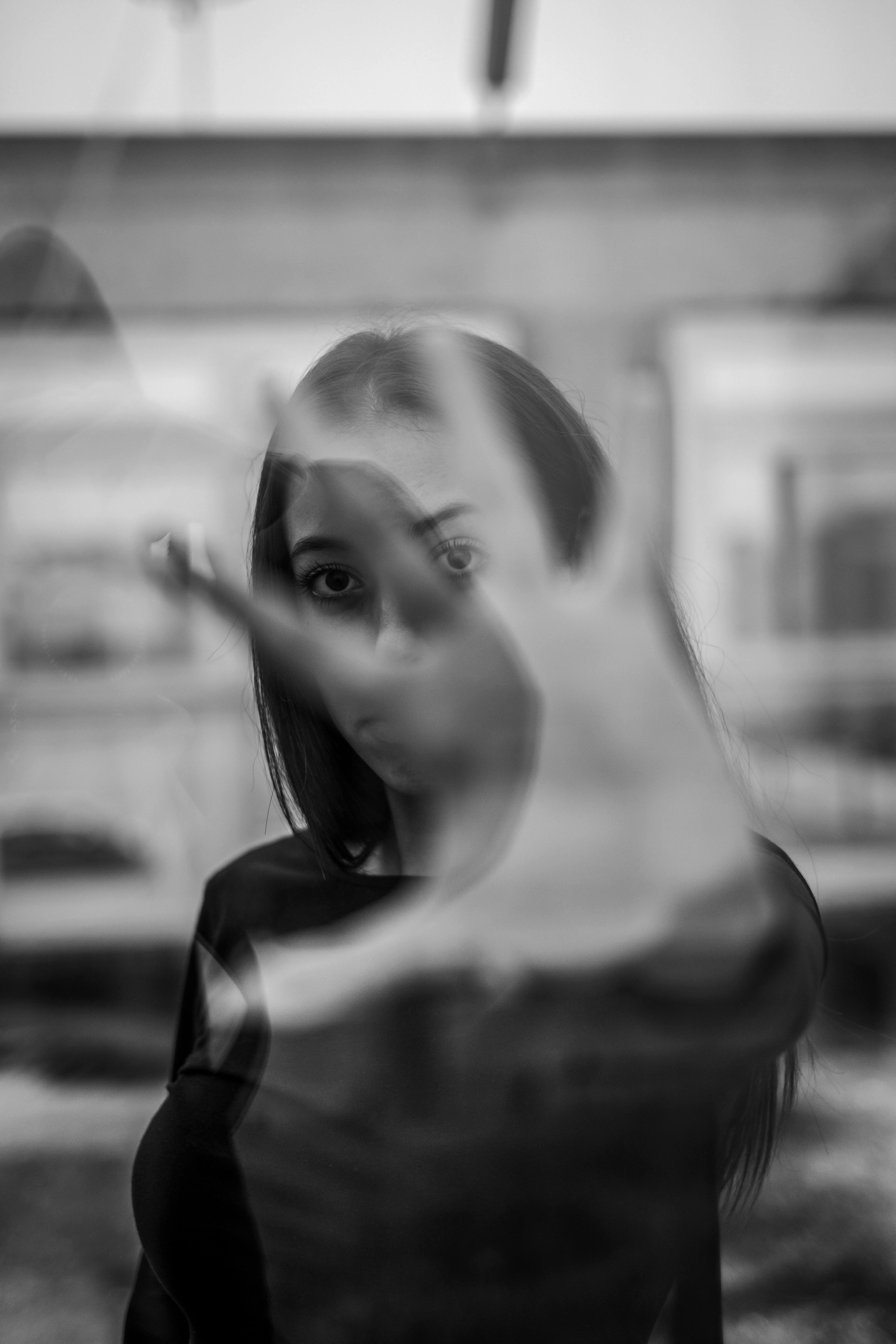 Close-Up Photography of Hand Near Window · Free Stock Photo