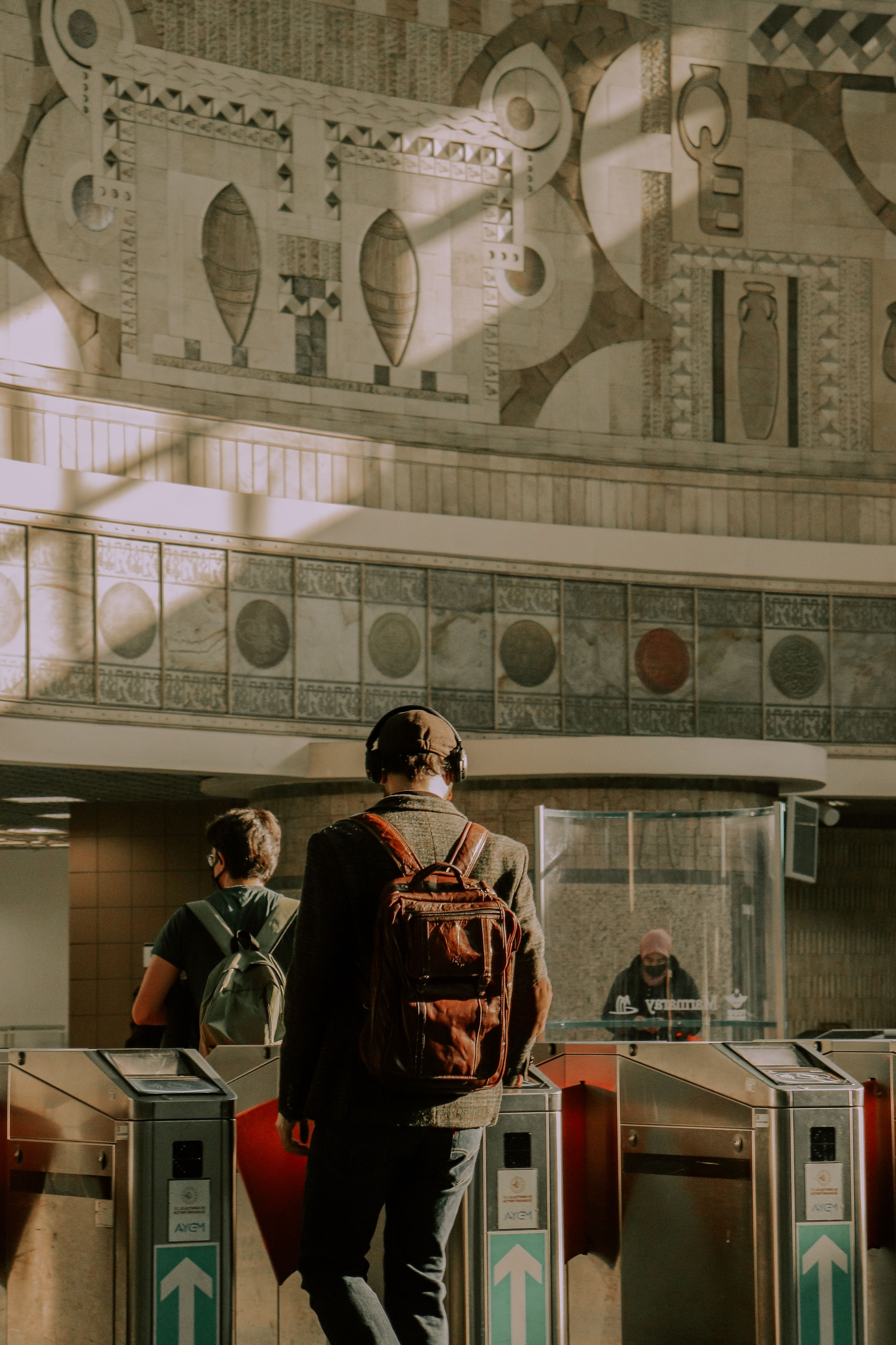 Back View of a Man Wearing a Brown Backpack · Free Stock Photo