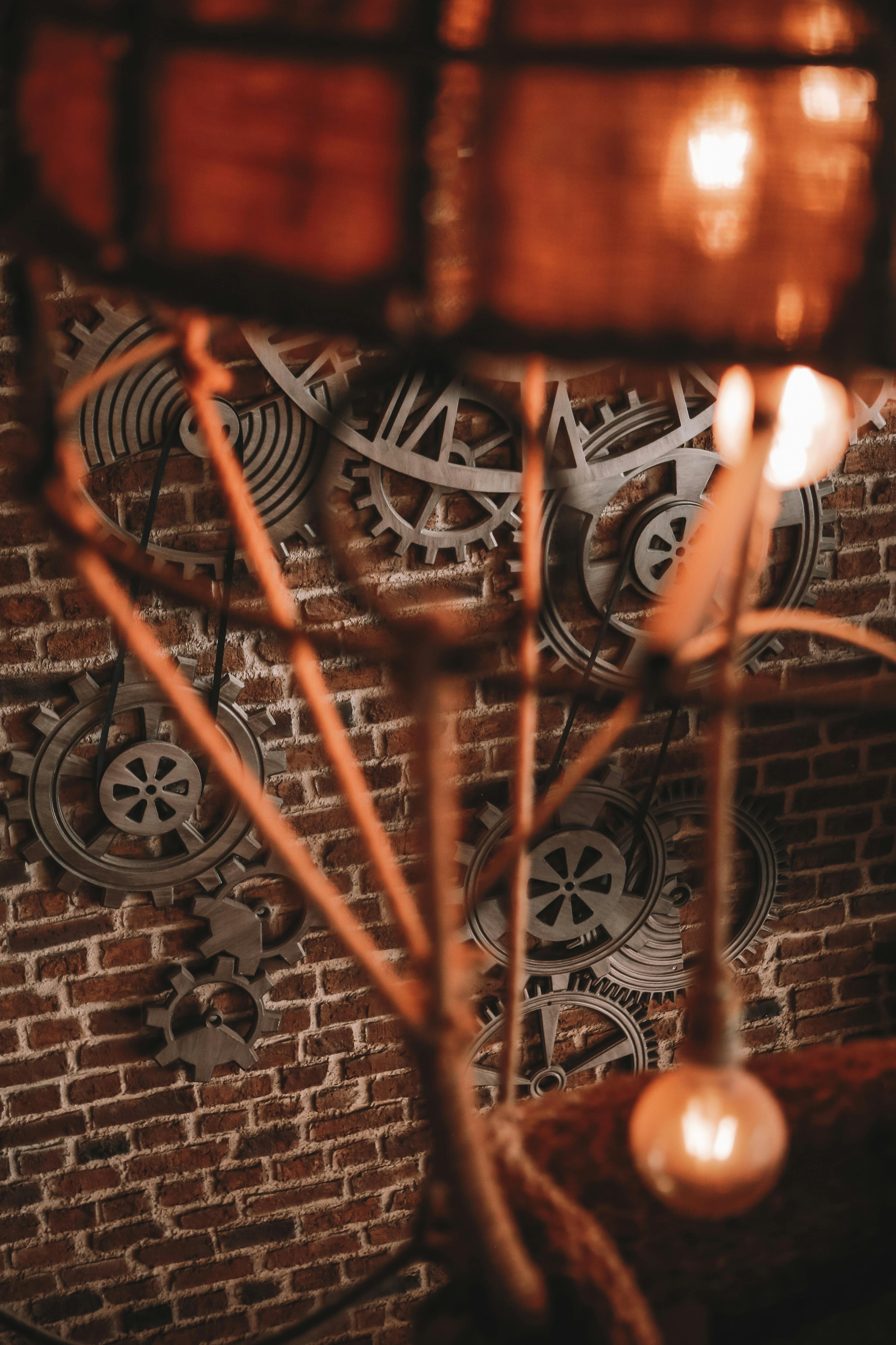 Cogs and Wheels as a Decoration on the Brick Wall · Free Stock Photo