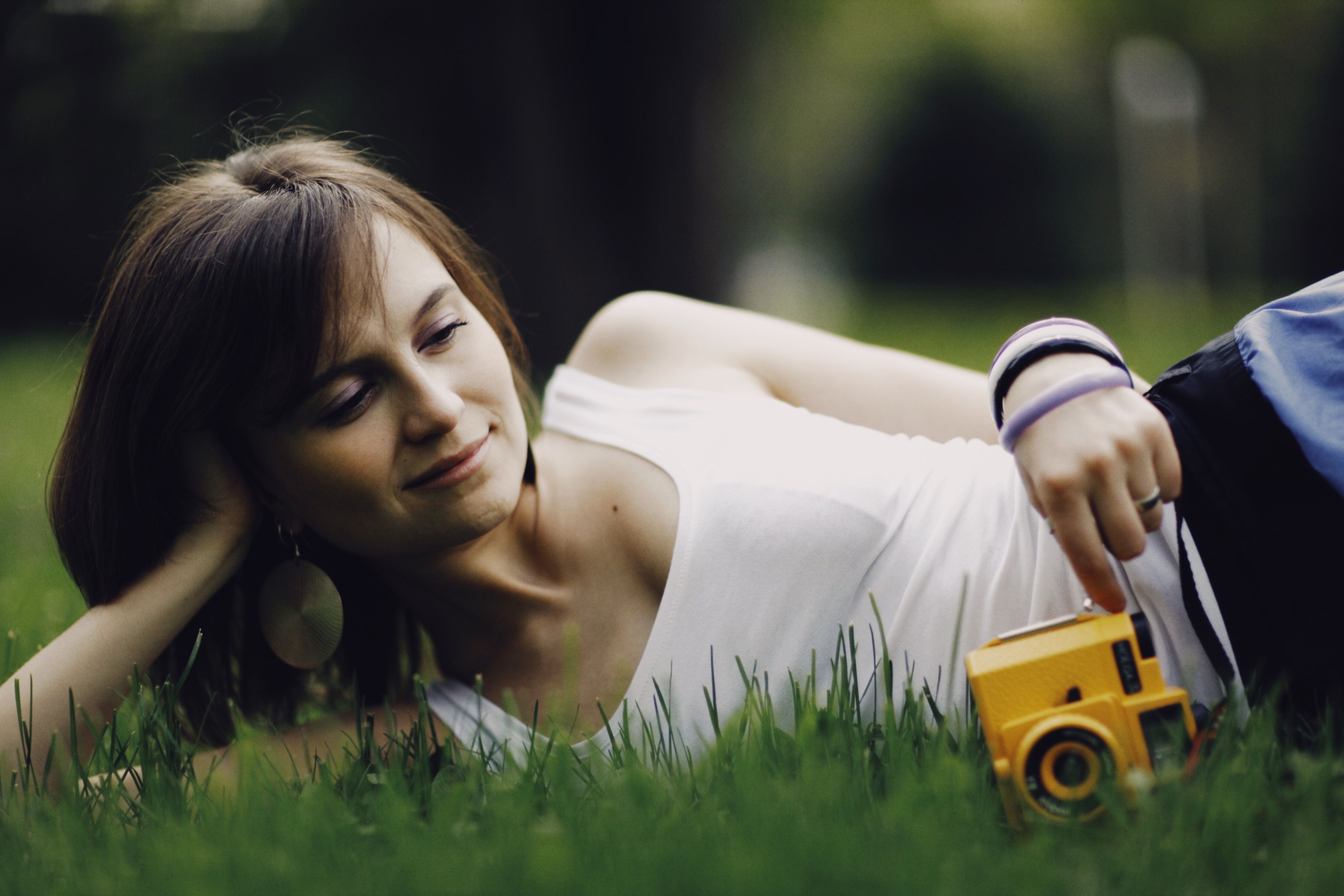 A Scared Woman Crouching while Her Hands are on Her Head · Free Stock Photo