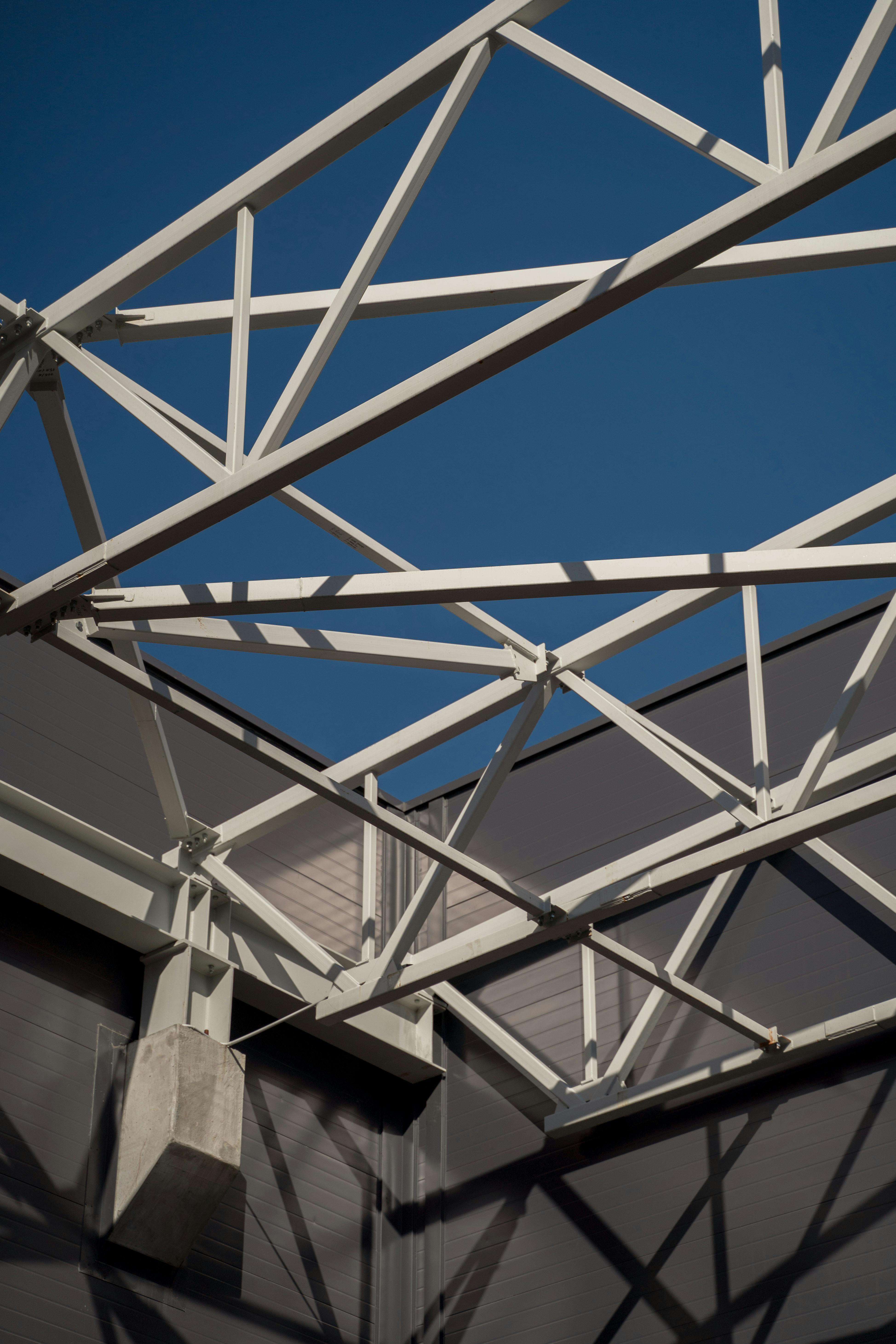 Steel Trusses Inside a Building Under Renovation · Free Stock Photo