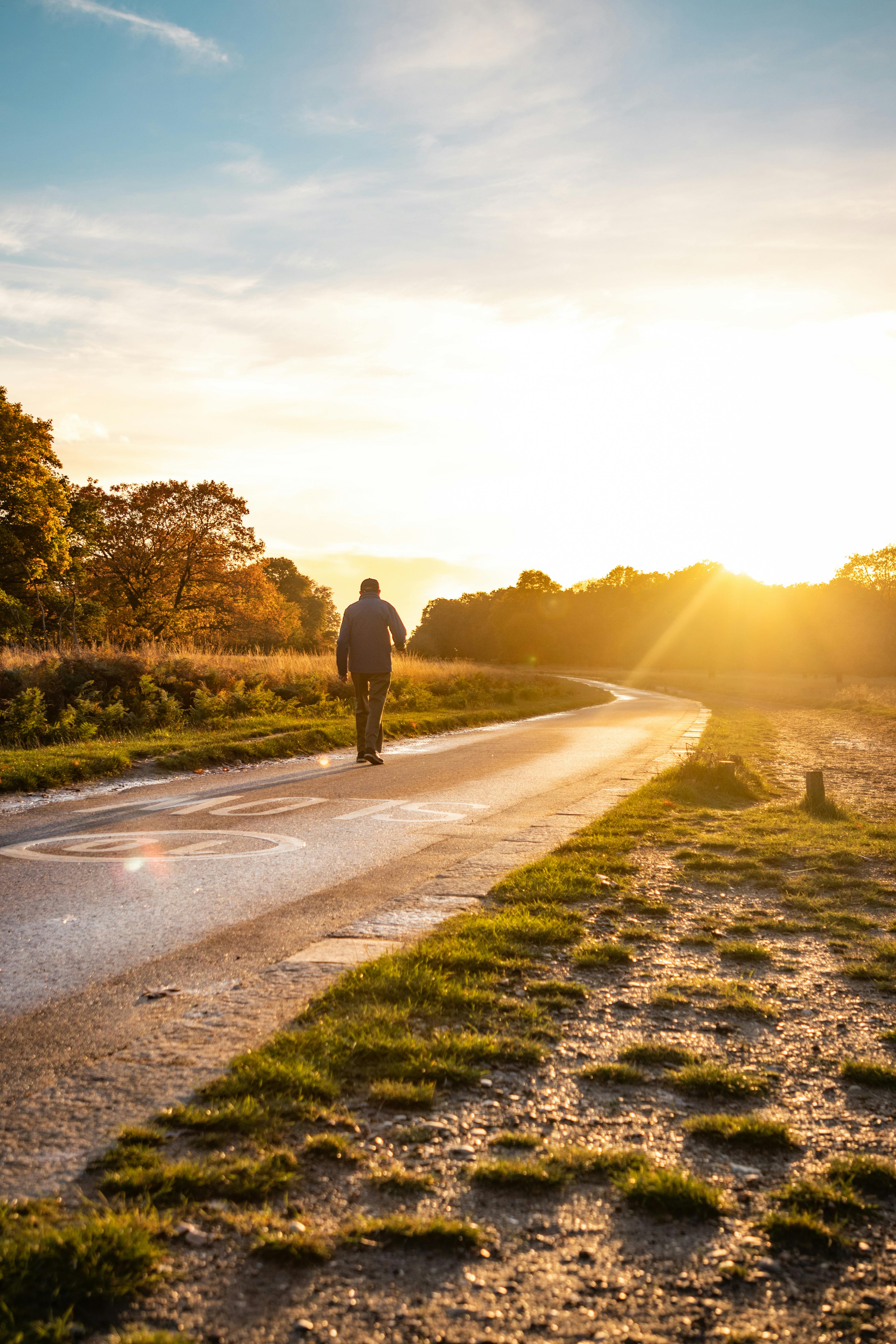 A Man Walking on the Street · Free Stock Photo