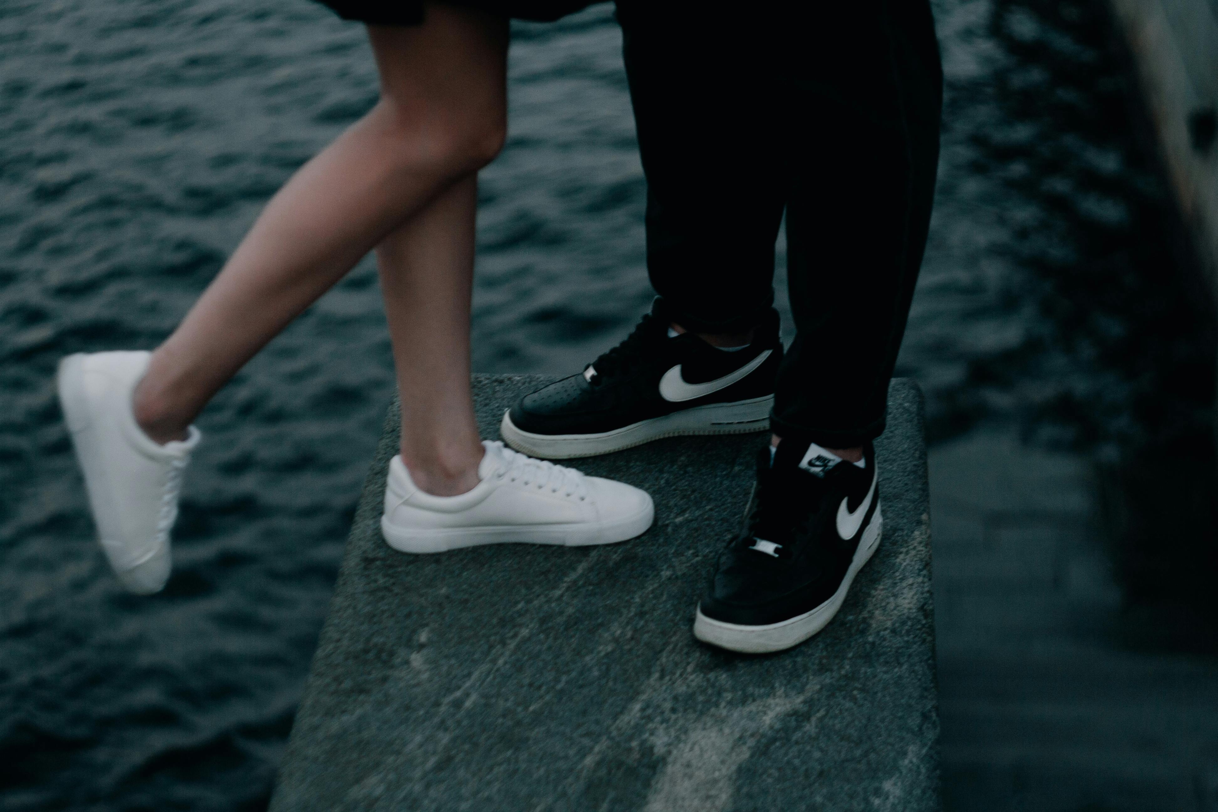 A Close-Up Shot of the Shoes of a Couple · Free Stock Photo