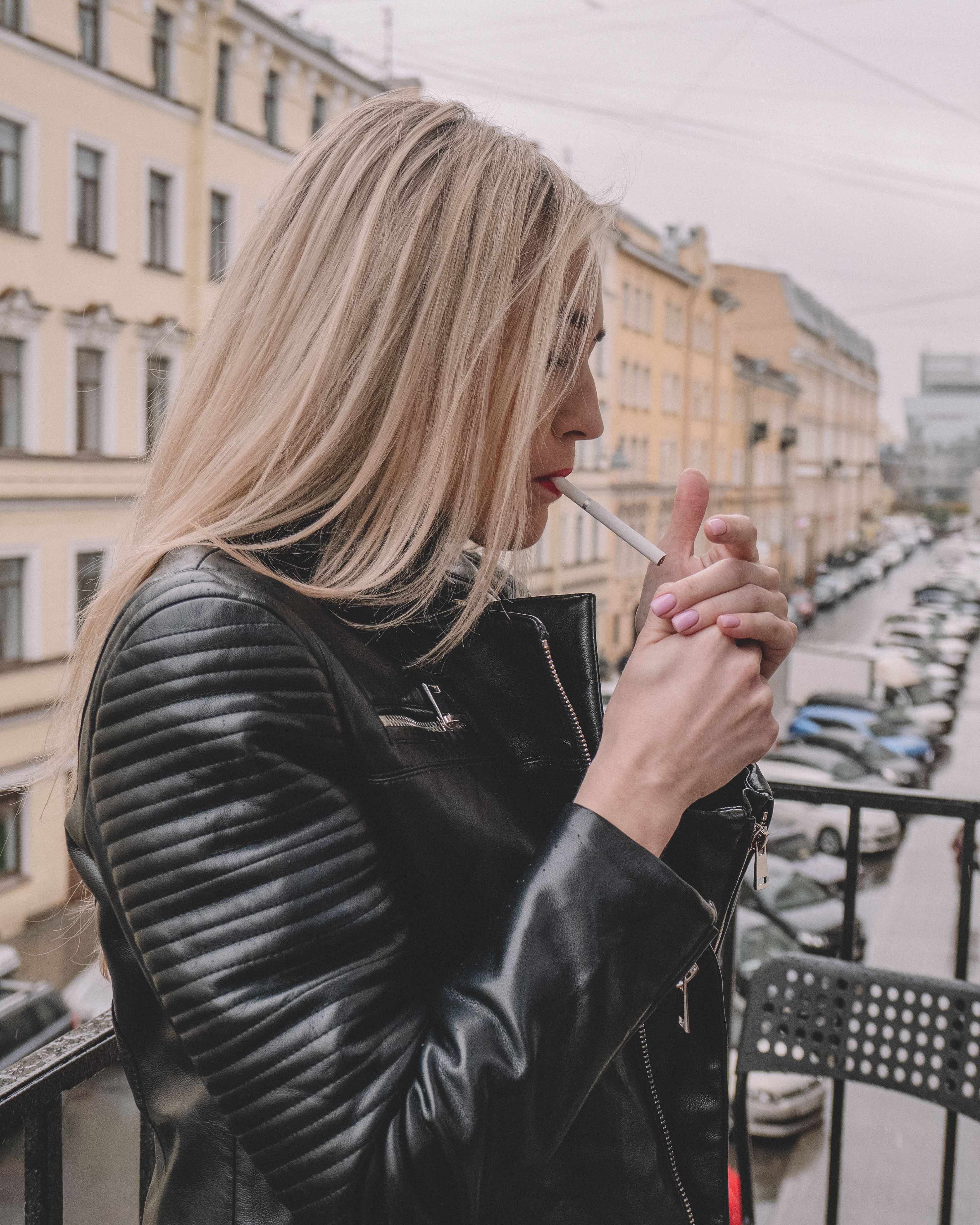 Woman in Black Leather Jacket Sitting on Gray Concrete Stairs · Free ...