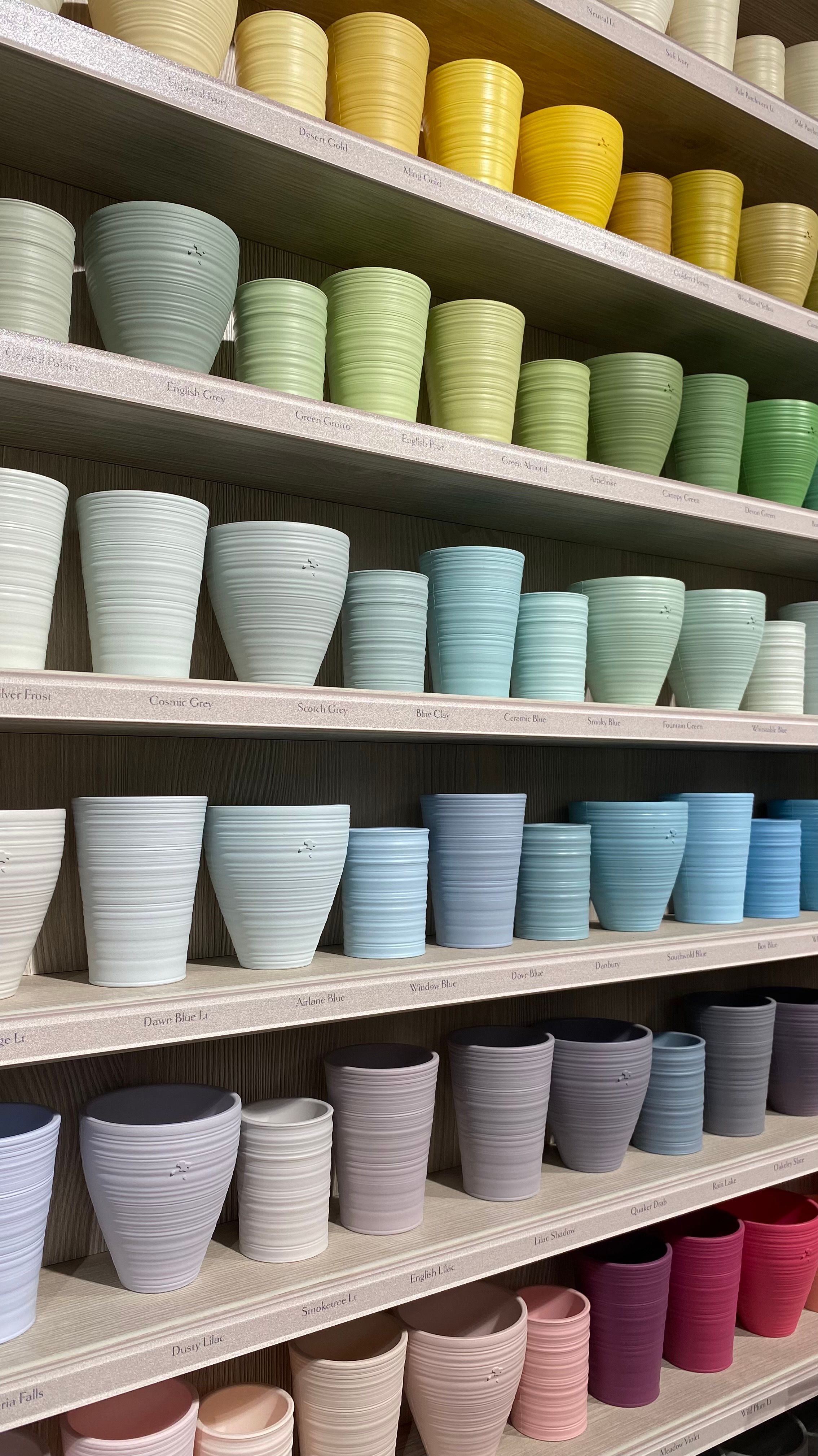 Colorful Ceramic Pots on Shelves · Free Stock Photo