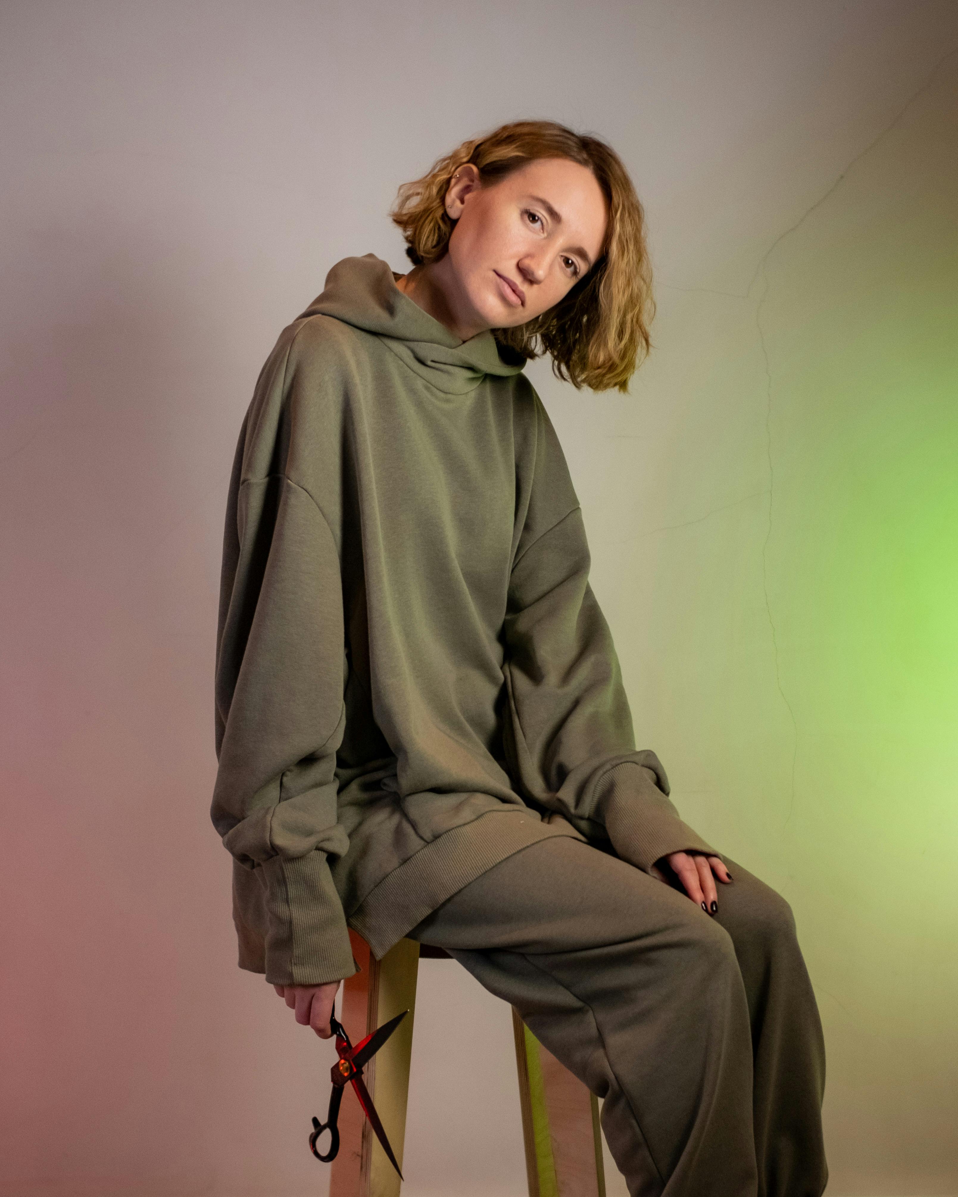 Faceless black woman in violet hoodie standing on white background ...