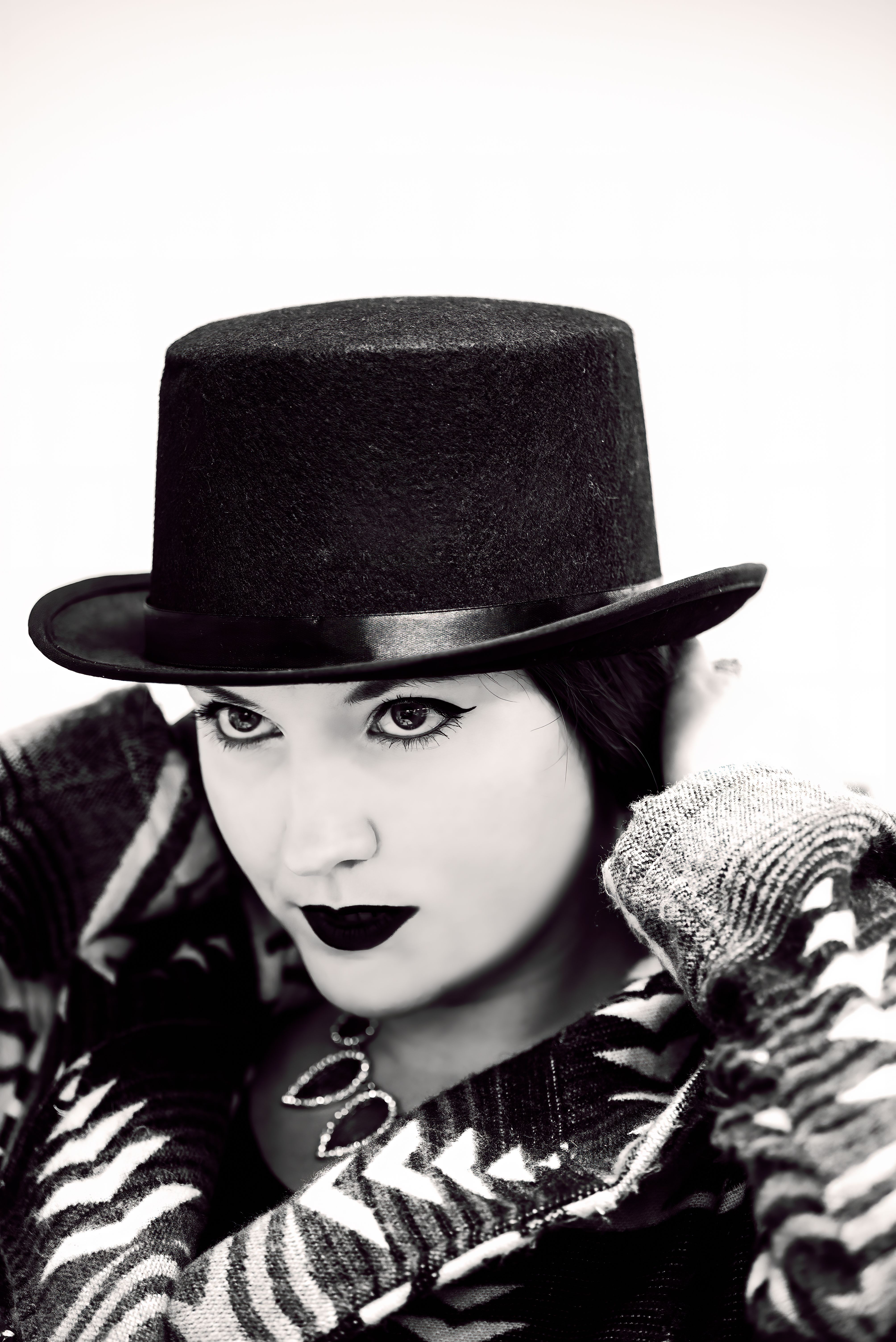 A Grayscale of a Woman Wearing a Top Hat · Free Stock Photo