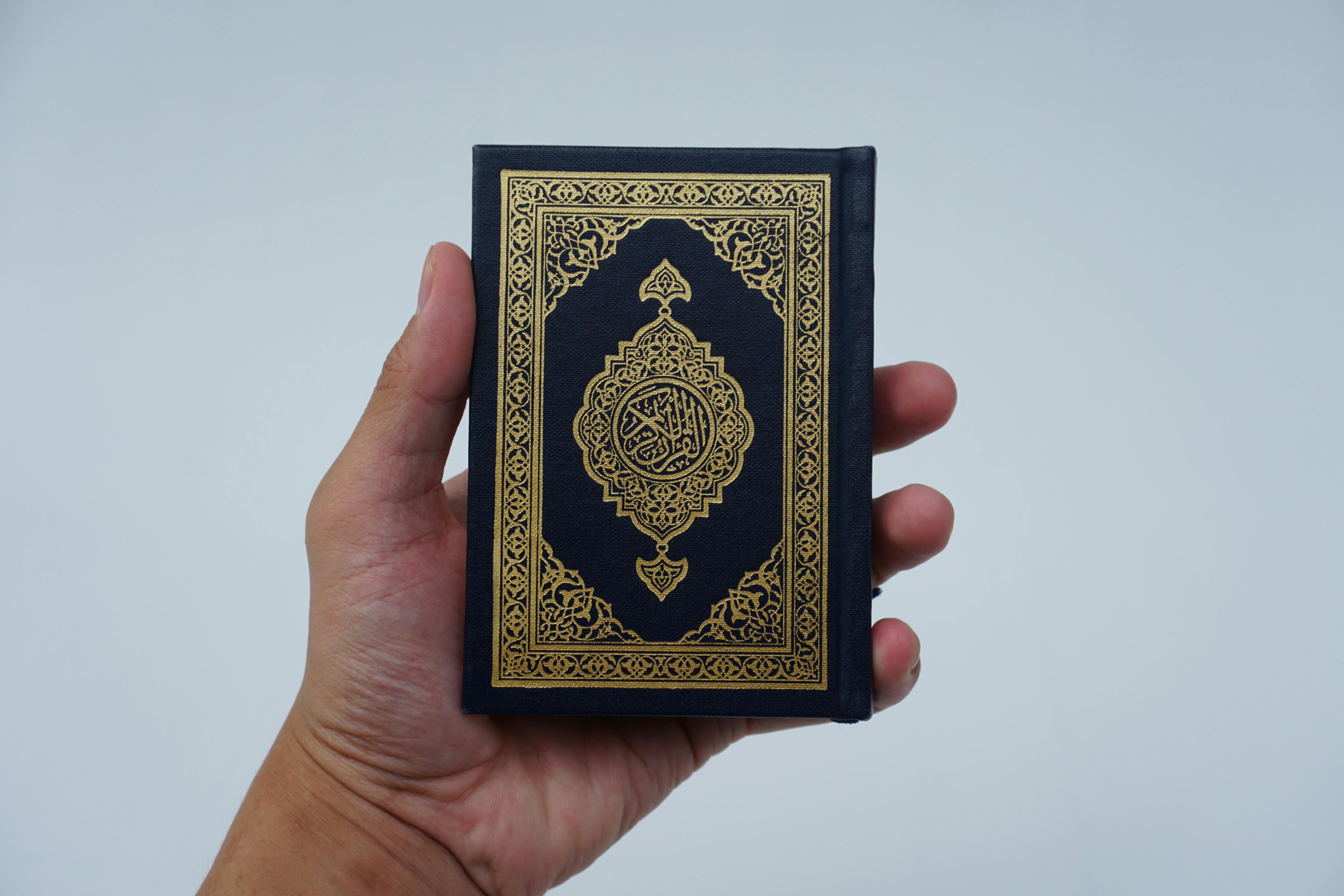 Quran in a Navy Blue Cover with a Decorative Golden Pattern · Free ...