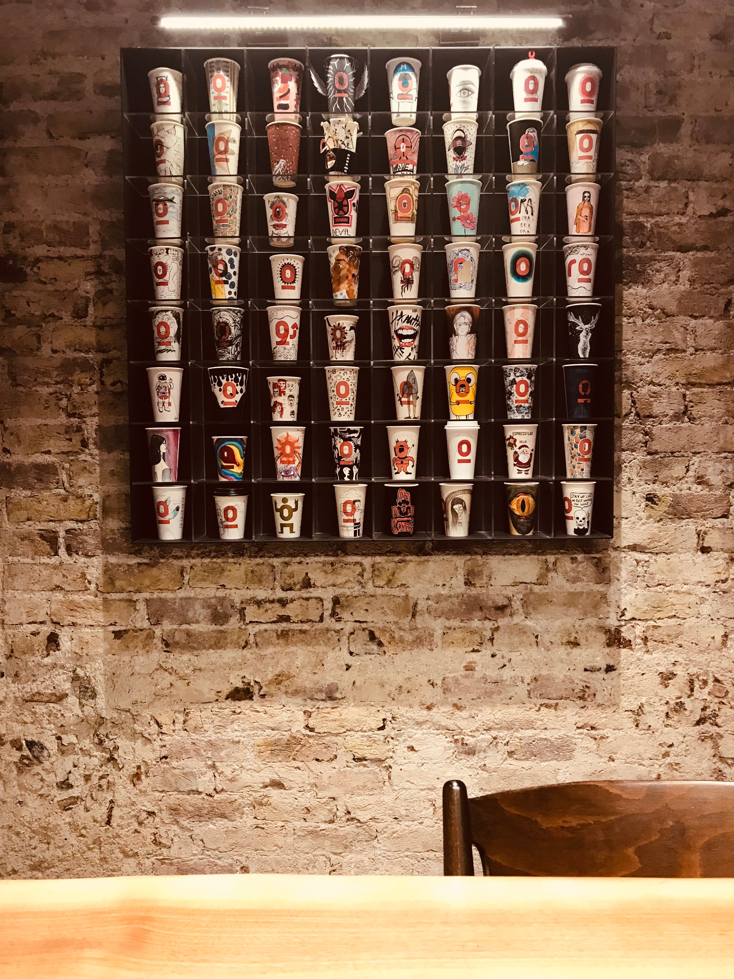 Cups Displayed on a Wall · Free Stock Photo