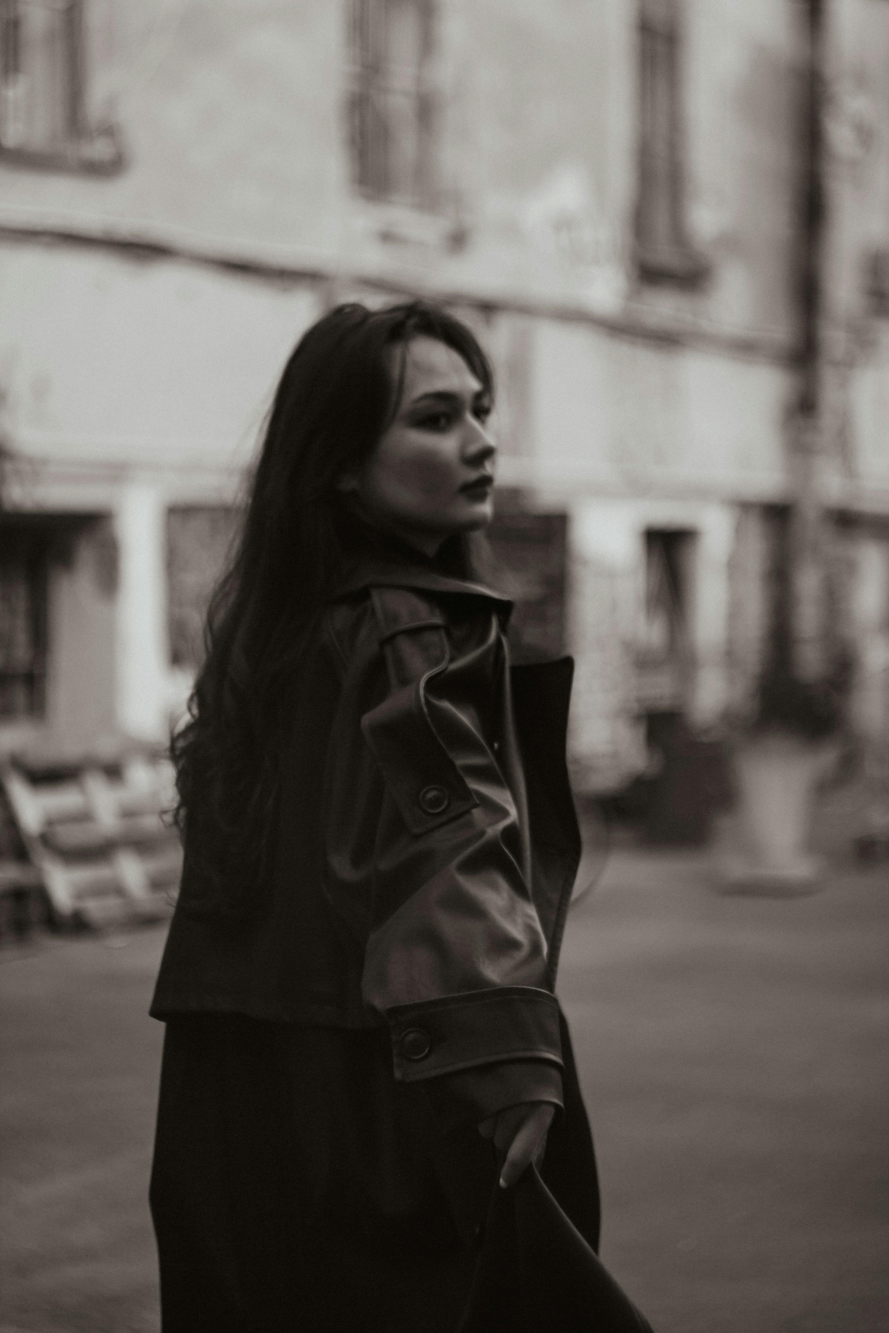 Grayscale Photo of a Woman in the Crowd · Free Stock Photo