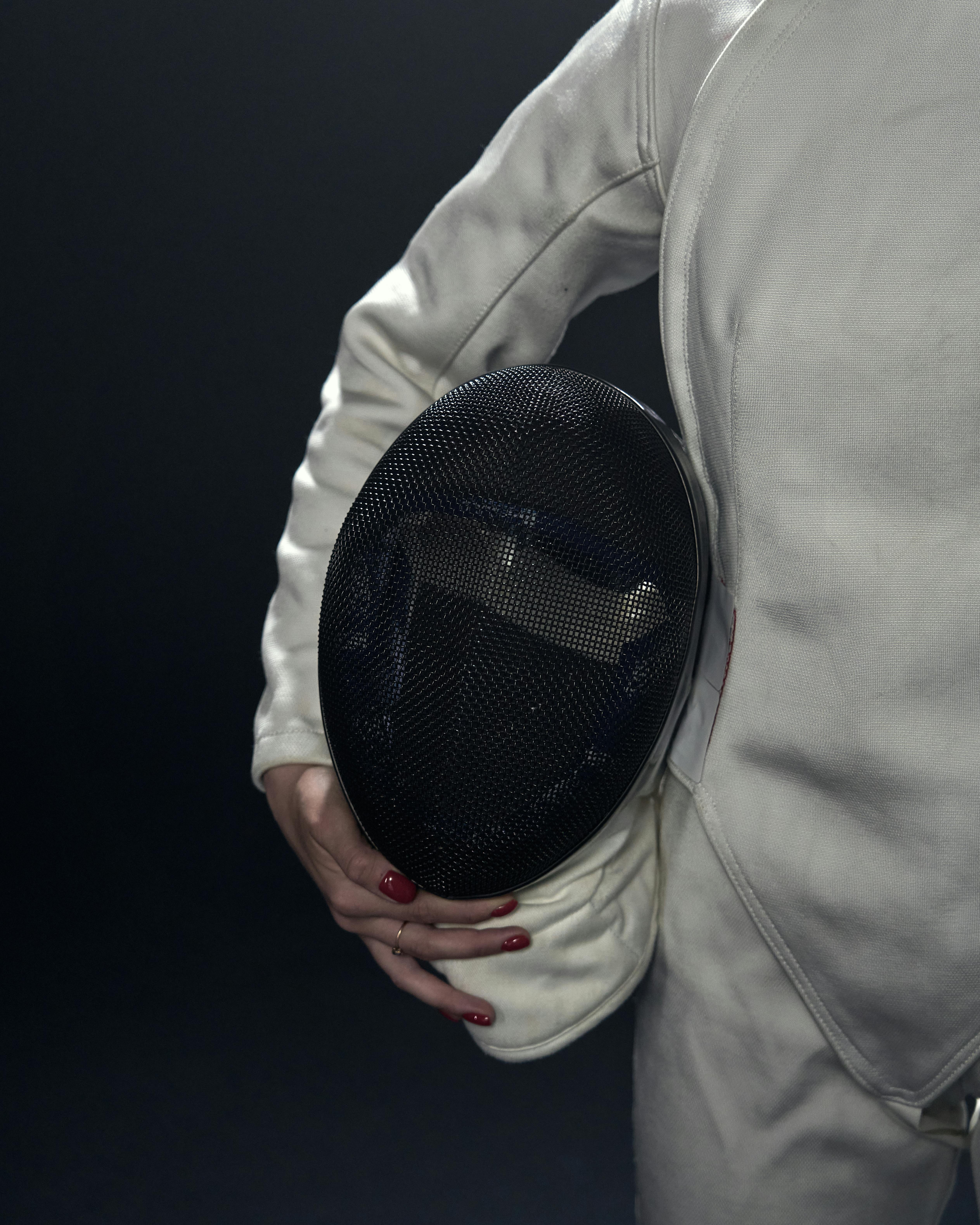 Fencer Holding a Fencing Mask · Free Stock Photo