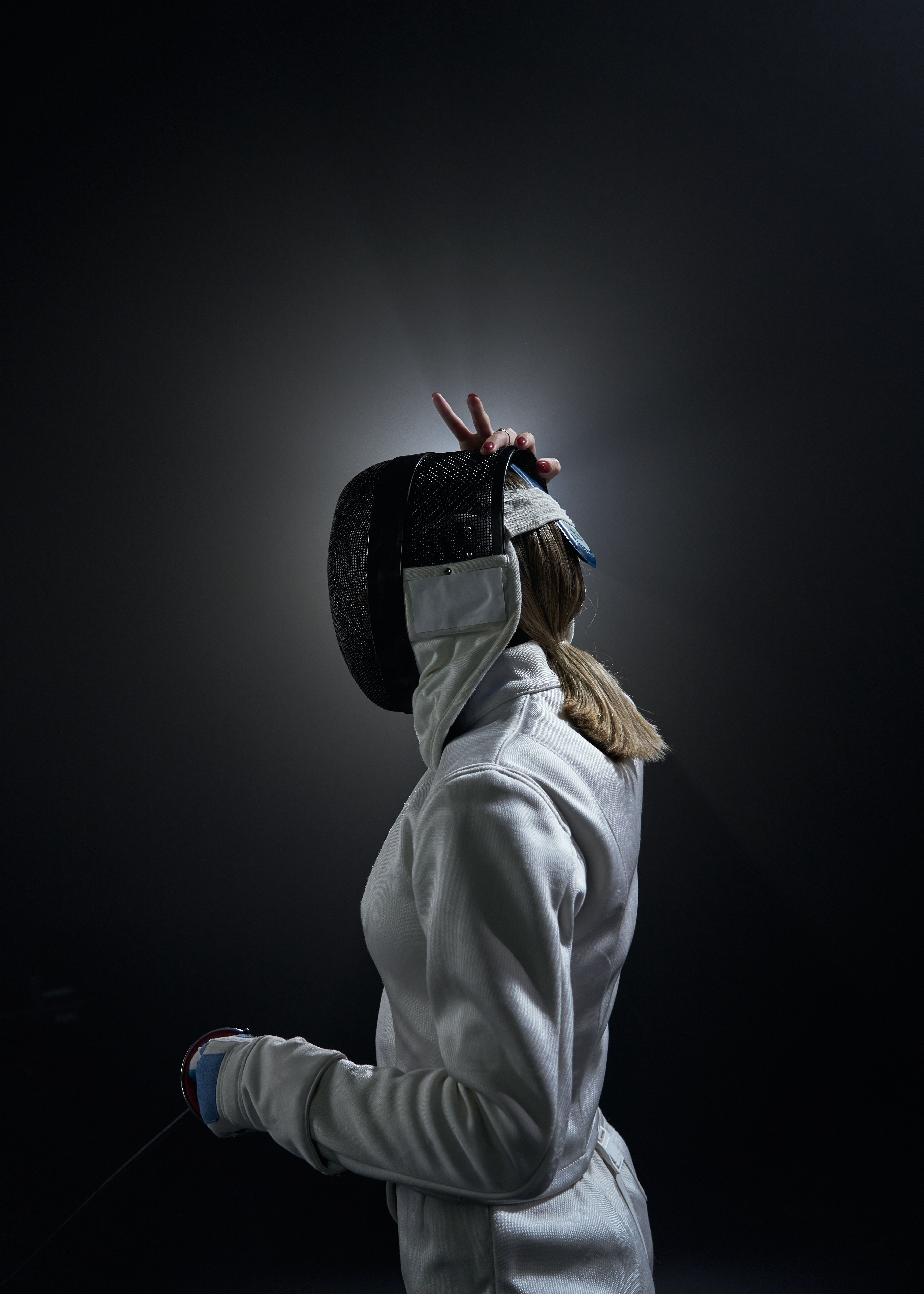 A Woman Wearing a Fencing Uniform · Free Stock Photo