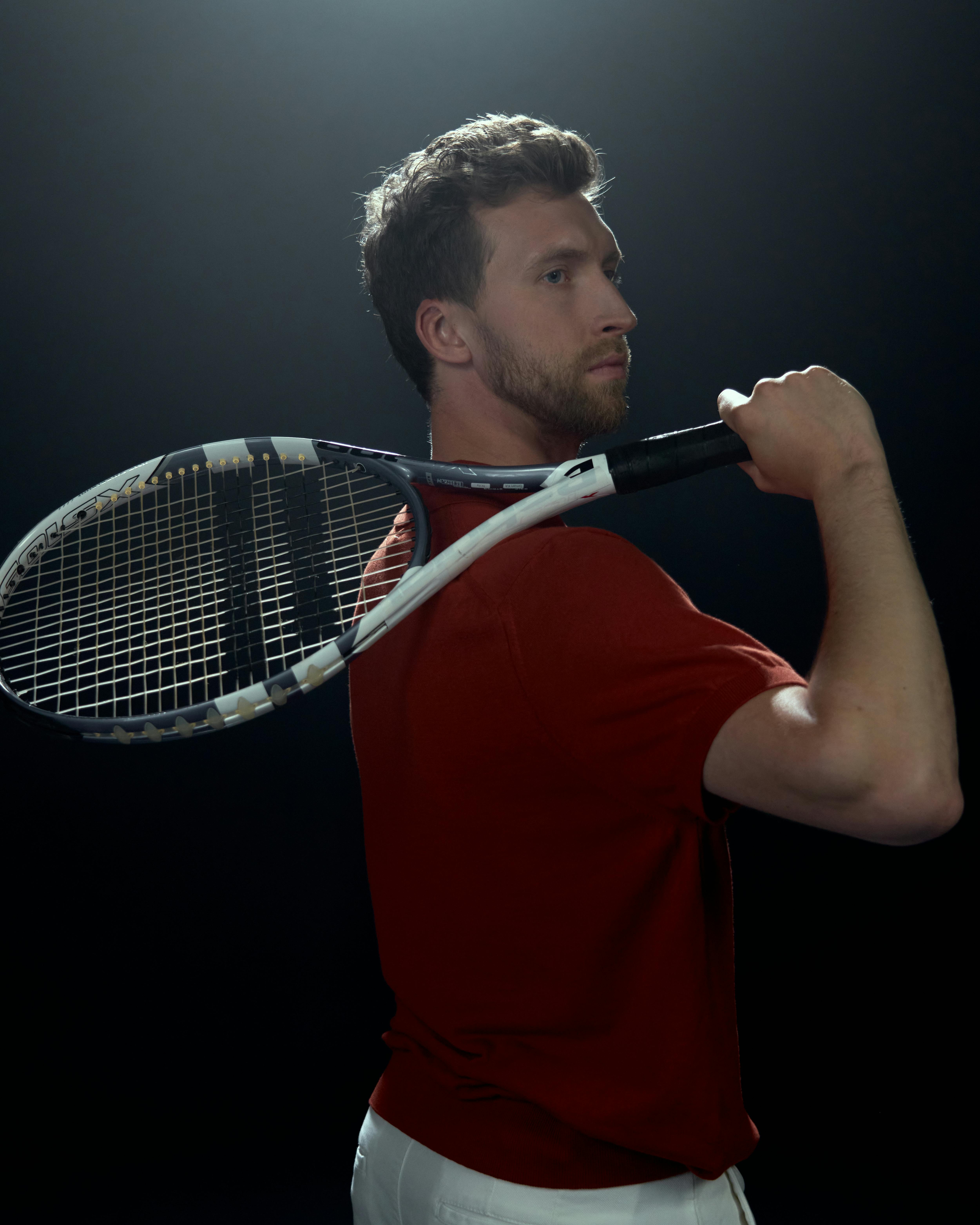 Person in Red Shirt Holding a Tennis Racket · Free Stock Photo
