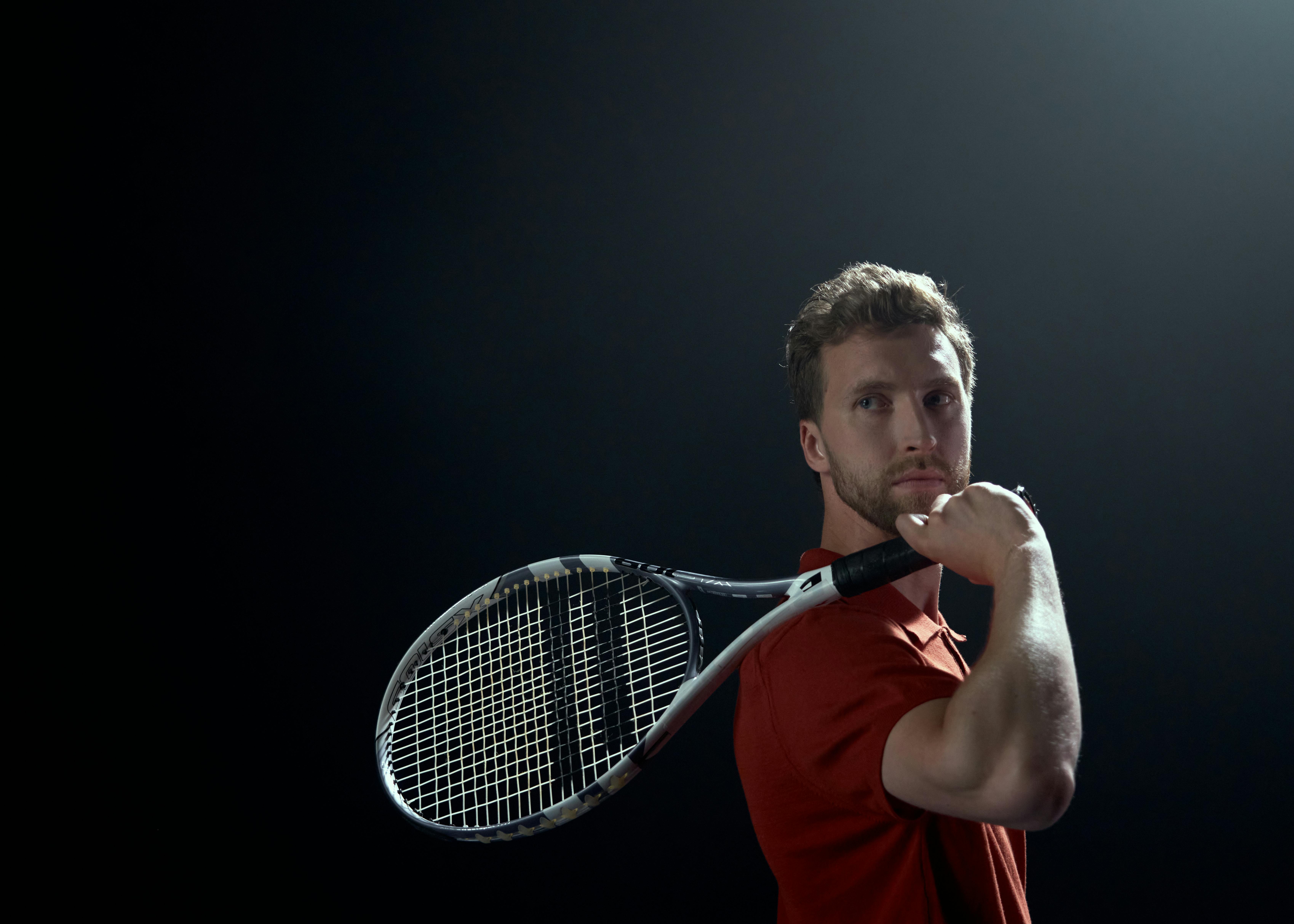 A Man Holding a Tennis Racket · Free Stock Photo